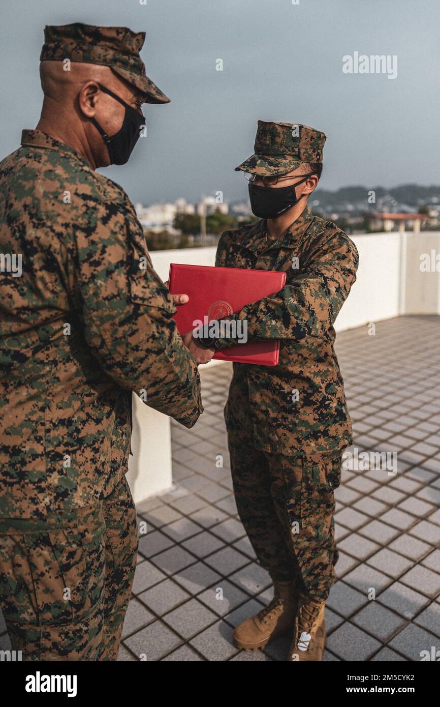 U.S. Marine Corps Cpl. Jazmyne Williams receives a Navy and Marine ...