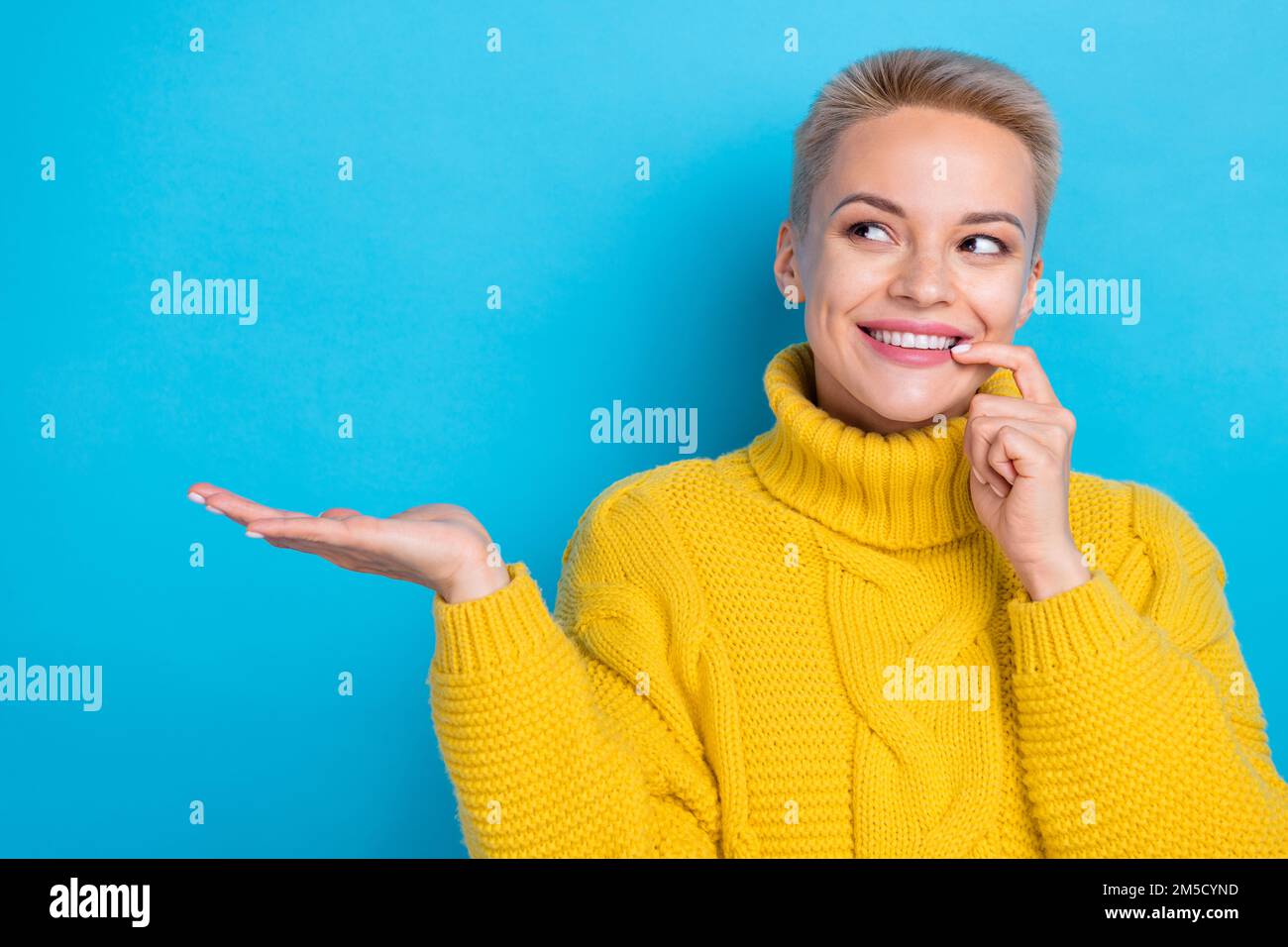 Photo of pretty cute lady wear trendy cozy clothes arm presenting empty ...