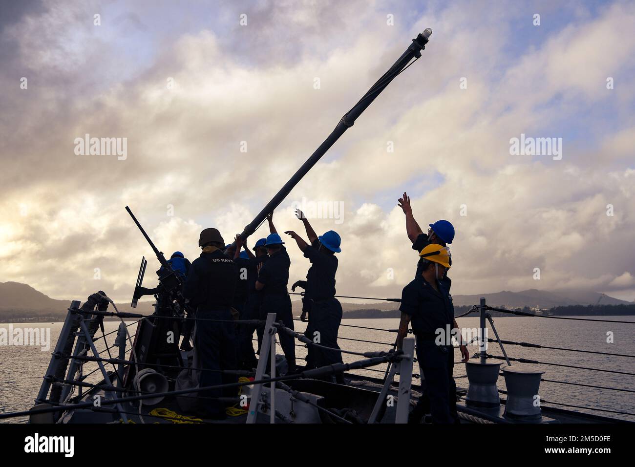 220303-N-TT059-1097 GUAM (Mar. 3, 2022) U.S. Navy Sailors raise the ...