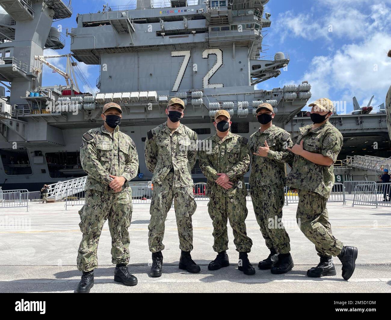 Sailors from Guam serving aboard the USS Abraham Lincoln (CVN 72) pose ...