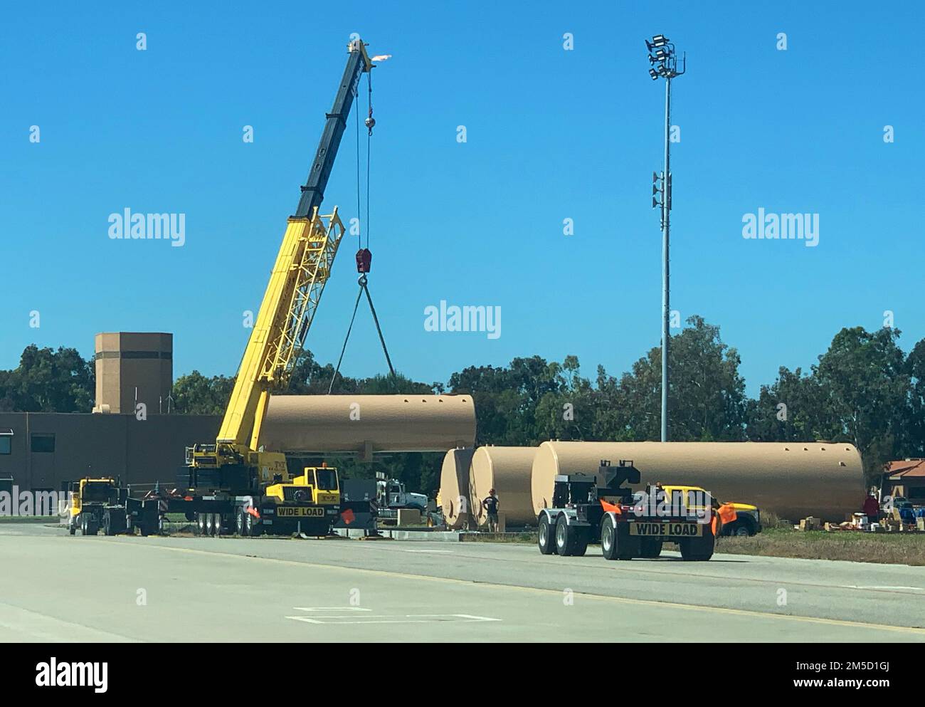 Service technicians from the Perimeter Solutions company install an ...
