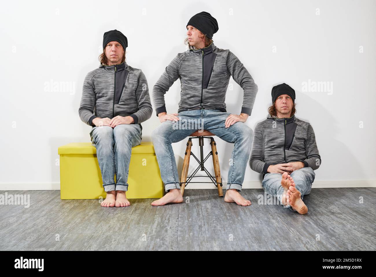 Man three times in different pose Stock Photo - Alamy