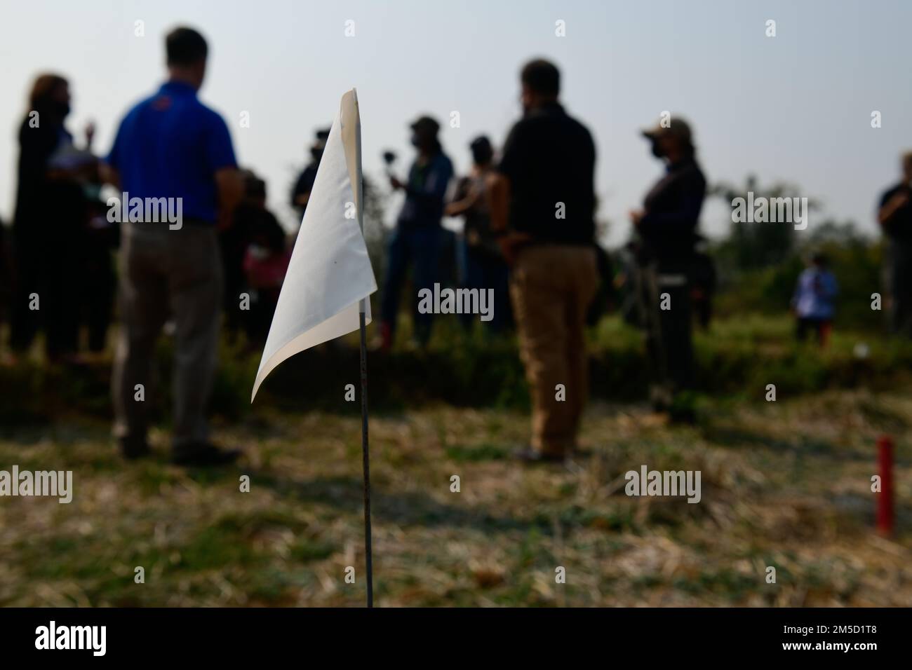 An explosive ordnance disposal pin-flag stands during a Defense POW/MIA ...