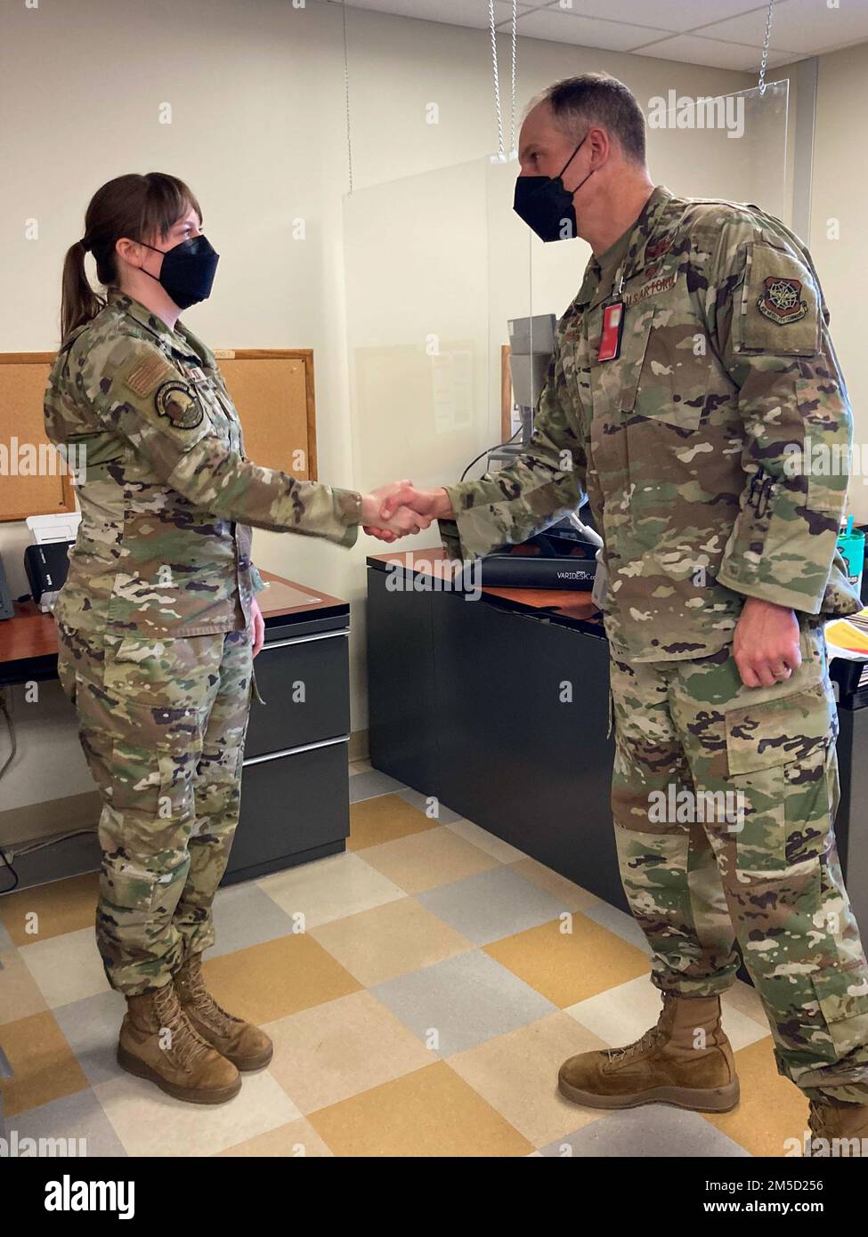 Col. Matt Husemann, right, 436th Airlift Wing commander, presents Staff Sgt. Morgan Stanfield ...