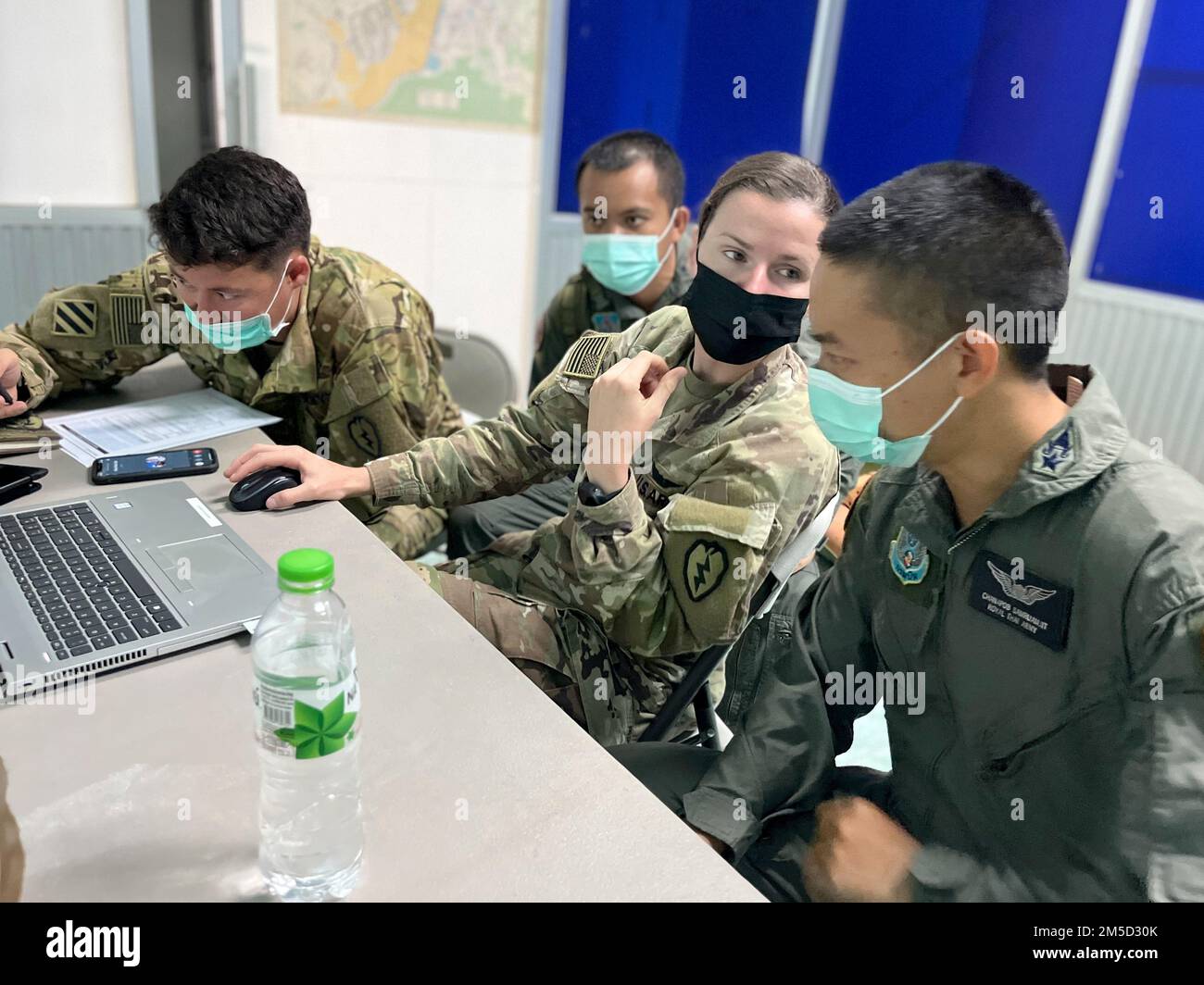 1st Lt. Nicole Chrzanowski (center) and Capt. Frank Fink (left ...