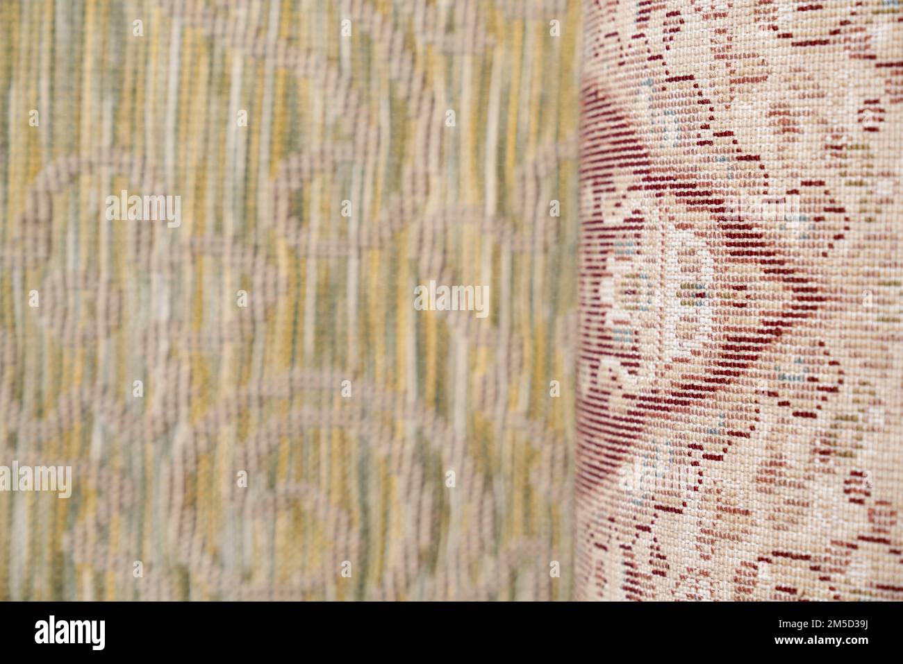 Front and back side of pastel multi-colored rug with pattern, which is ...