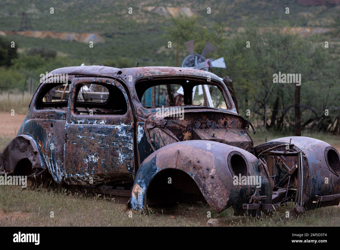 A vintage rusty old abandoned car decaying on a rural field Stock Photo ...
