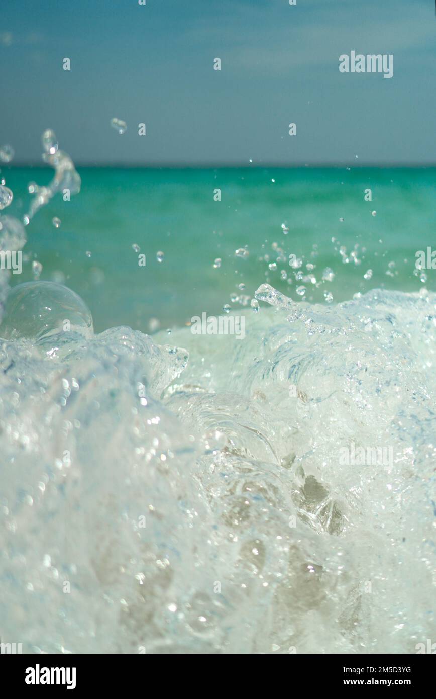 Caribbean wave breaks Stock Photo - Alamy