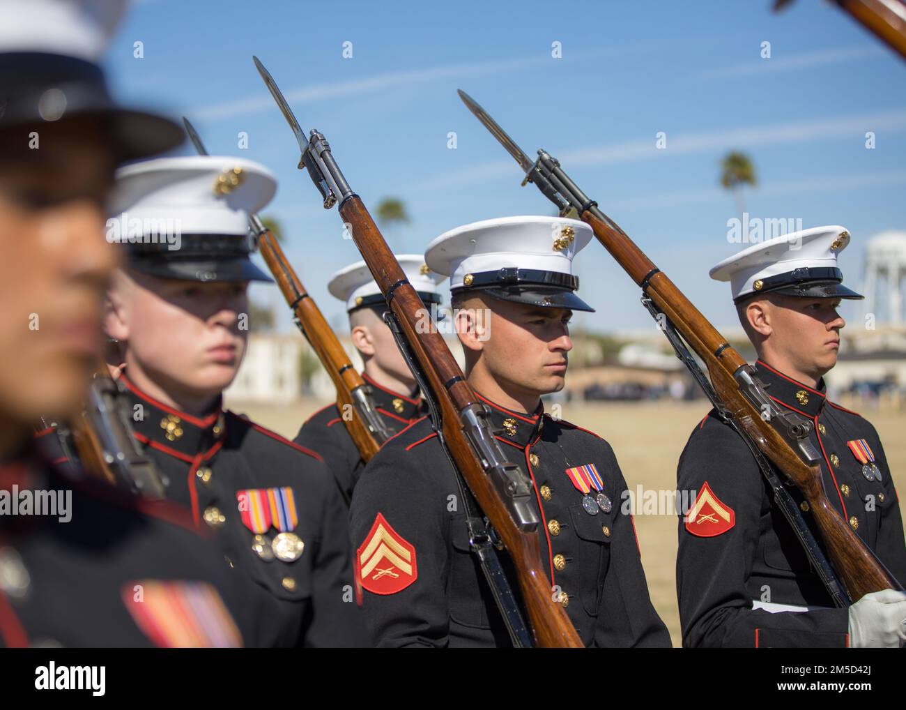 U.S. Marines with the Silent Drill Platoon march in formation after a ...
