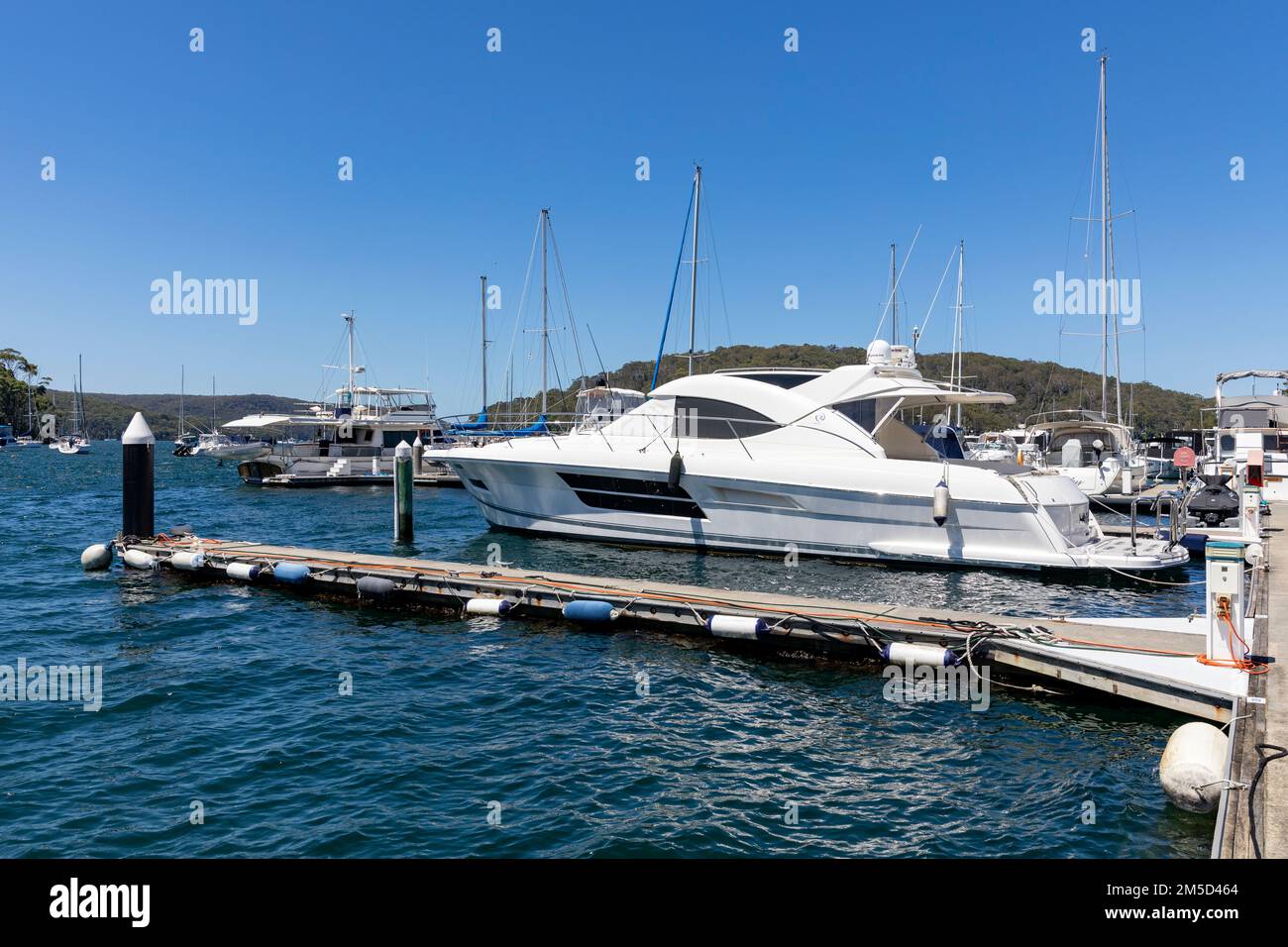 Riviera sports cruiser motor yacht moored on Pittwater Sydney in a boat ...