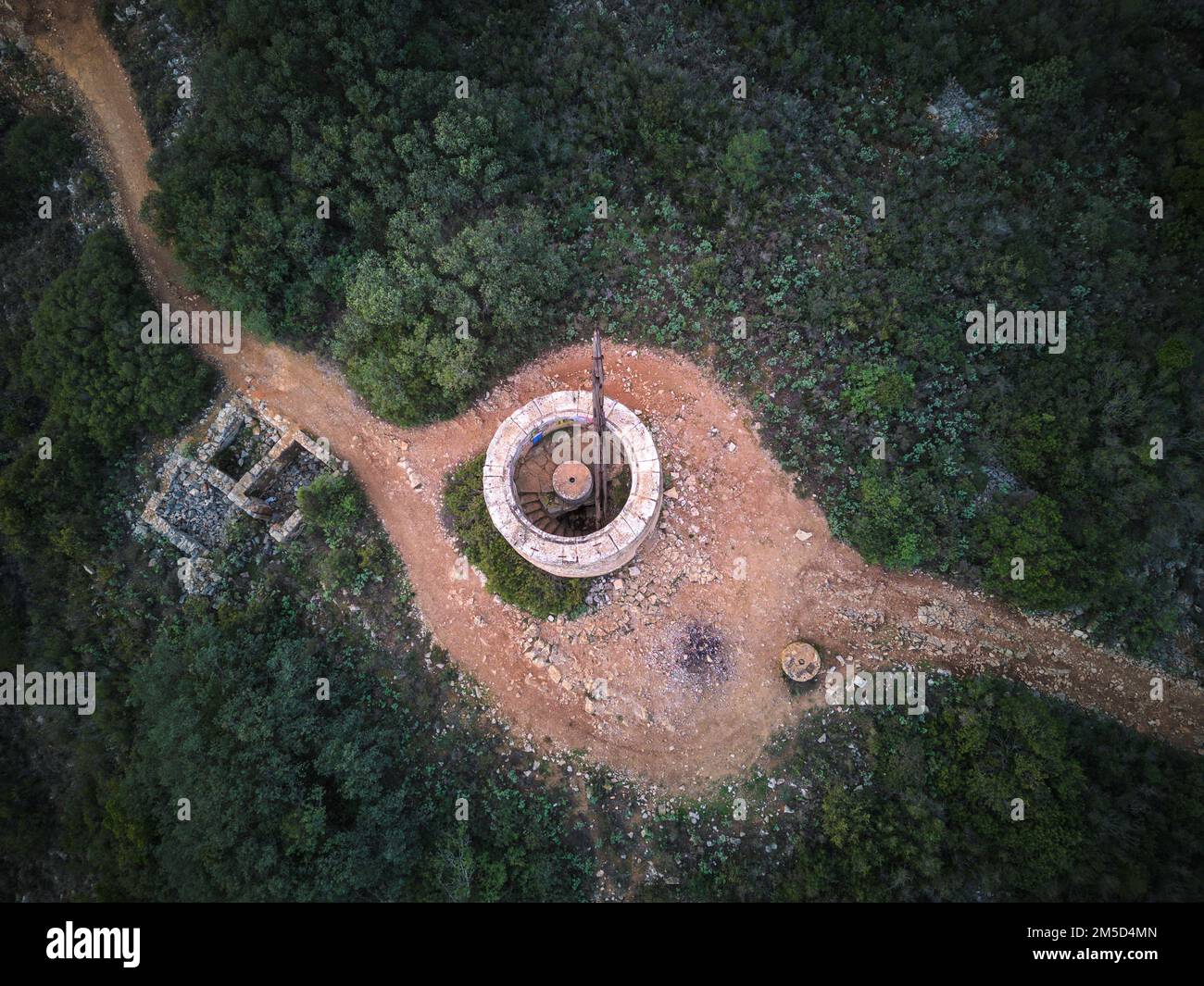 An aerial view of Torre de Vallferosa surrounded by trees, in Spain ...
