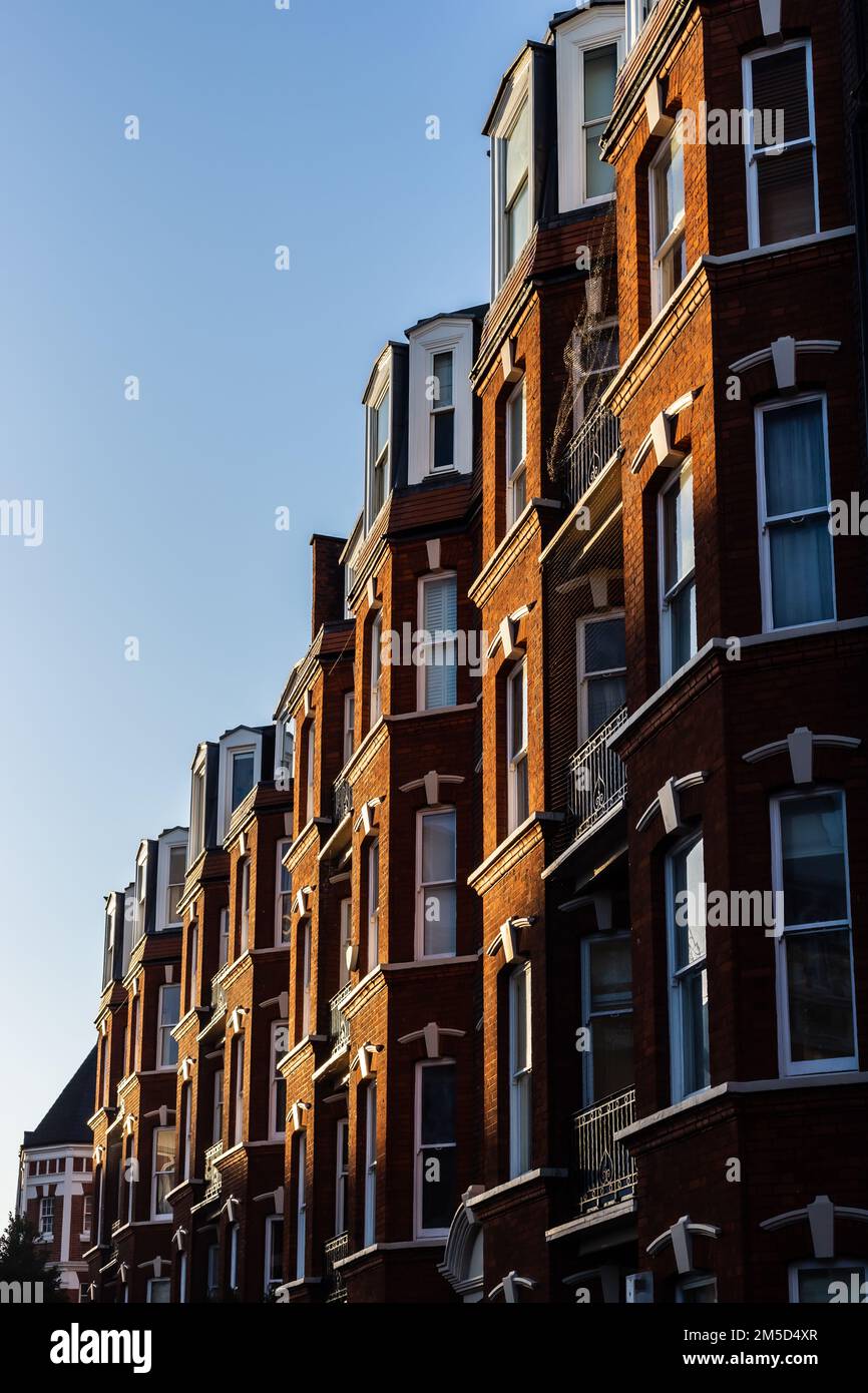A block of flats in North West London with warm sun shining on ...