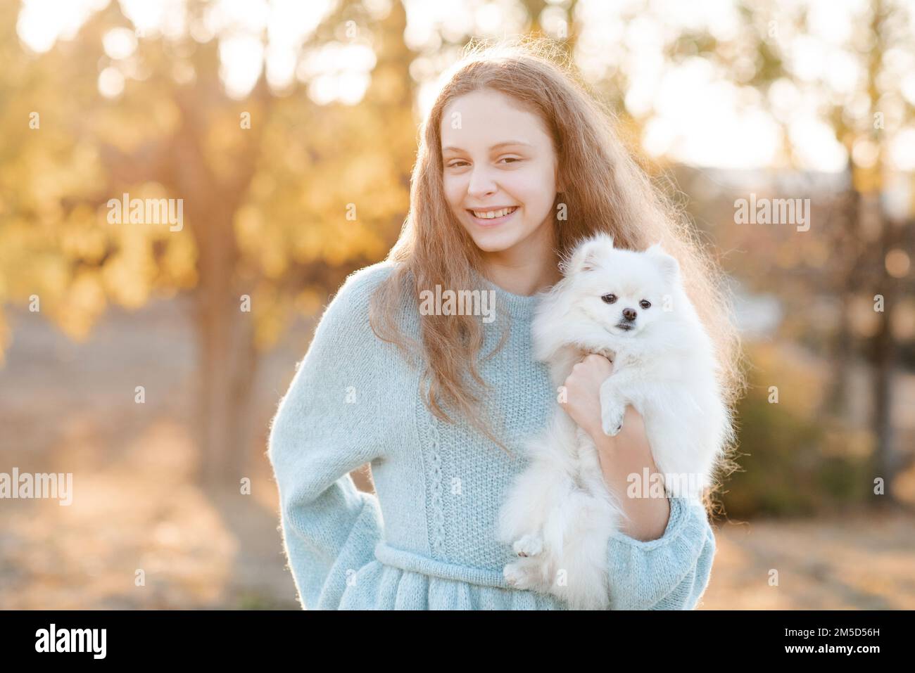 Cute Smiling Teenage Girl 15 16 Year Old Holding White Fluffy Spitz