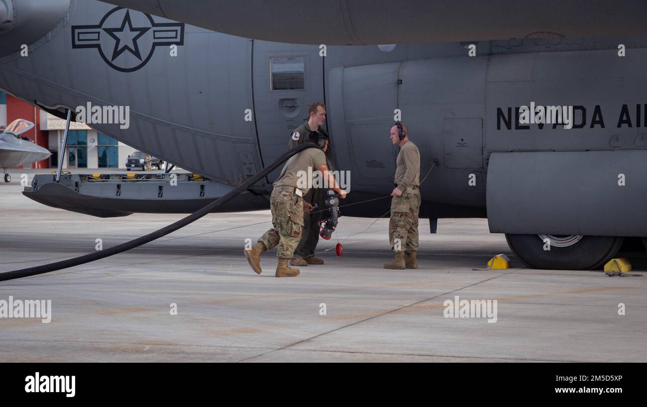 Airmen from the Nevada and Hawaii Air National Guard off-load fuel from ...