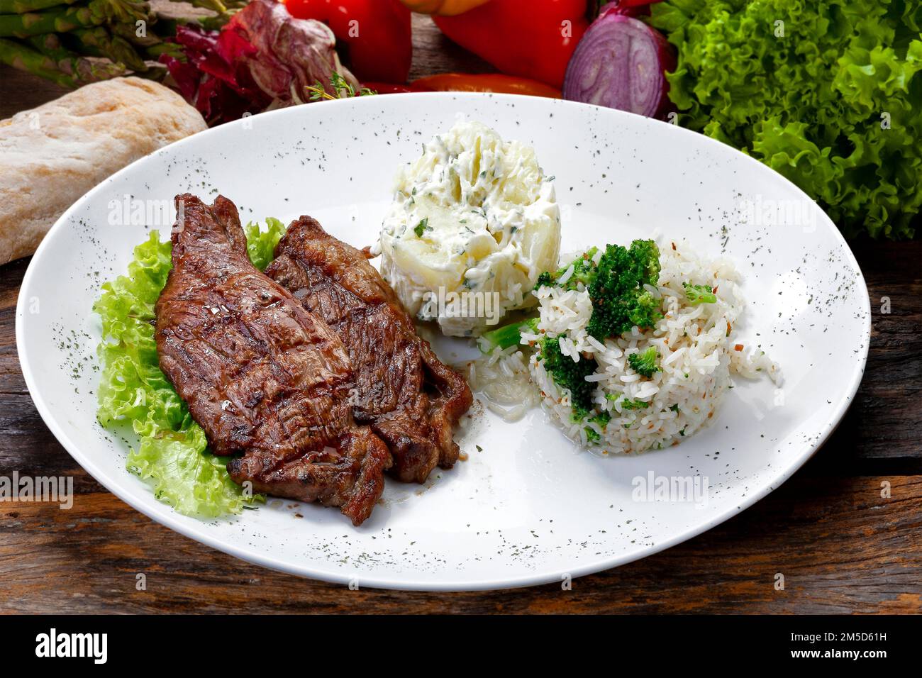 Beef steak with potatoes and rice in isolated white background Stock ...