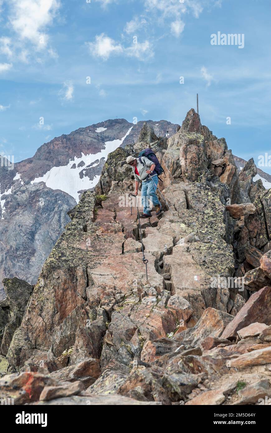 The image is of mountain walkers trekkers in the Oetztal Alps in the ...