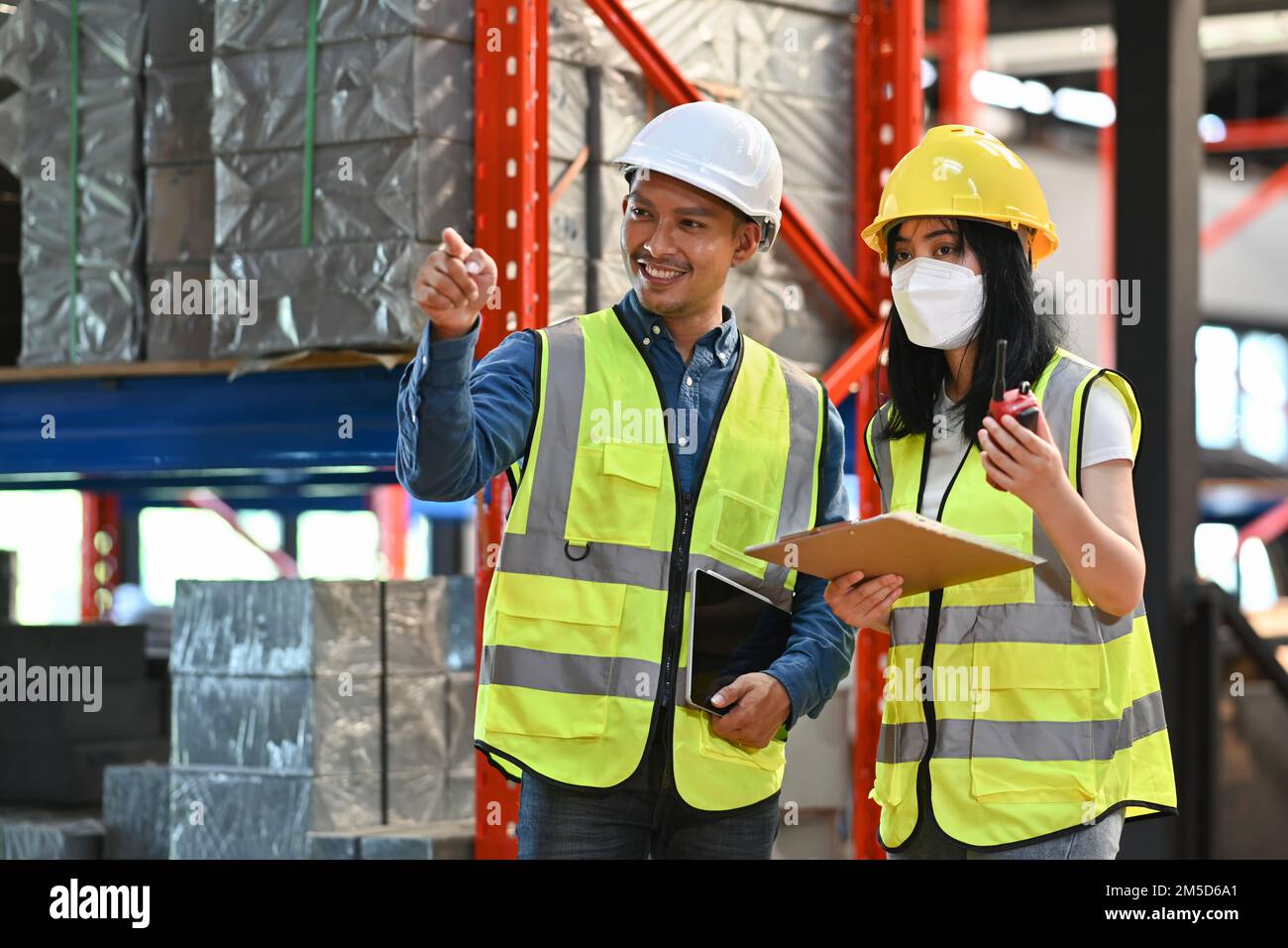 Storehouse workers are checking stock and inventory in retail warehouse ...