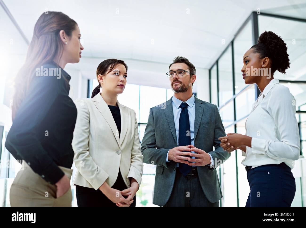 Lets consider our plan of action carefully. a group of businesspeople ...