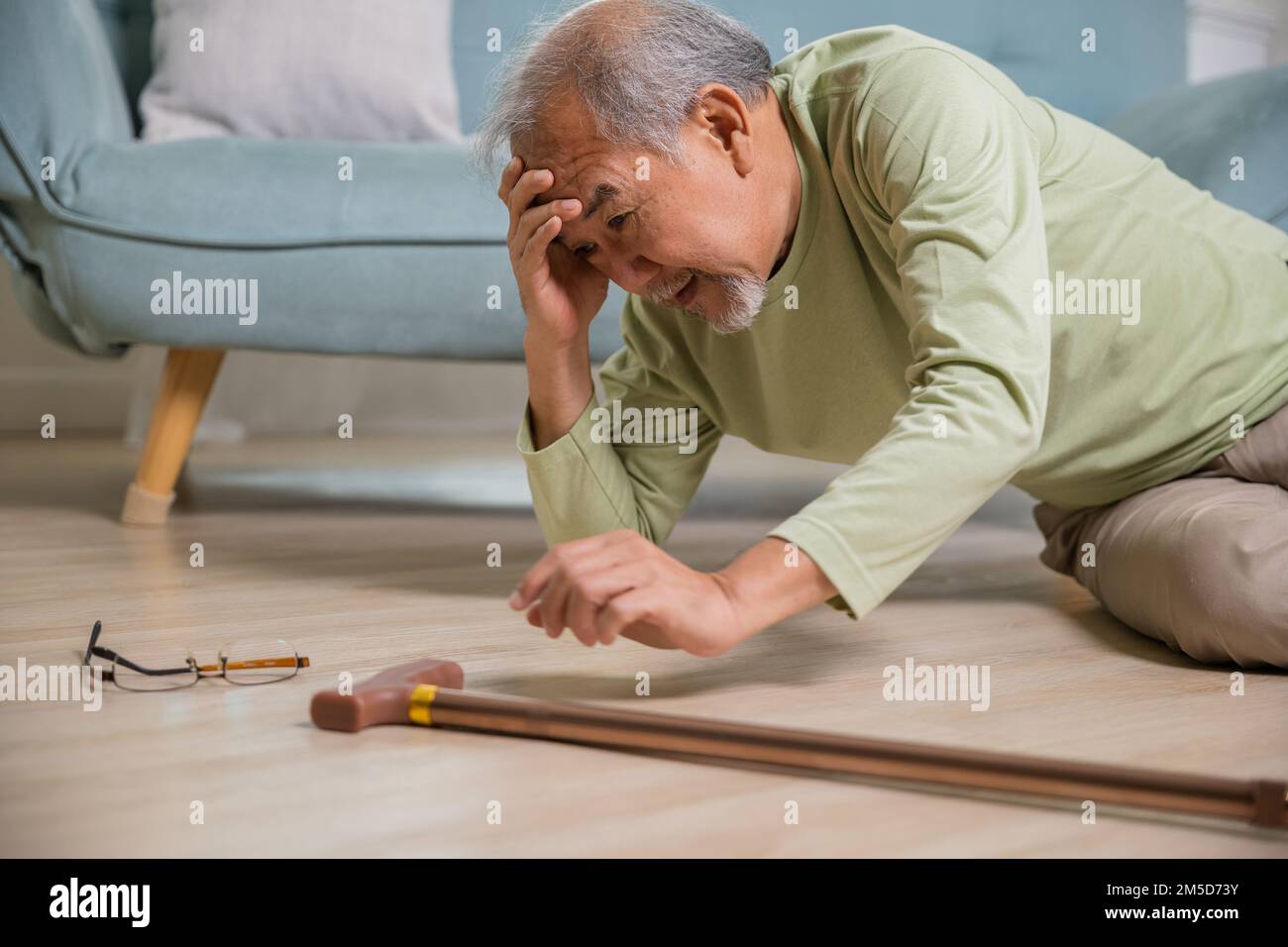 Sick senior old man falling down lying on the ground because stumbled ...