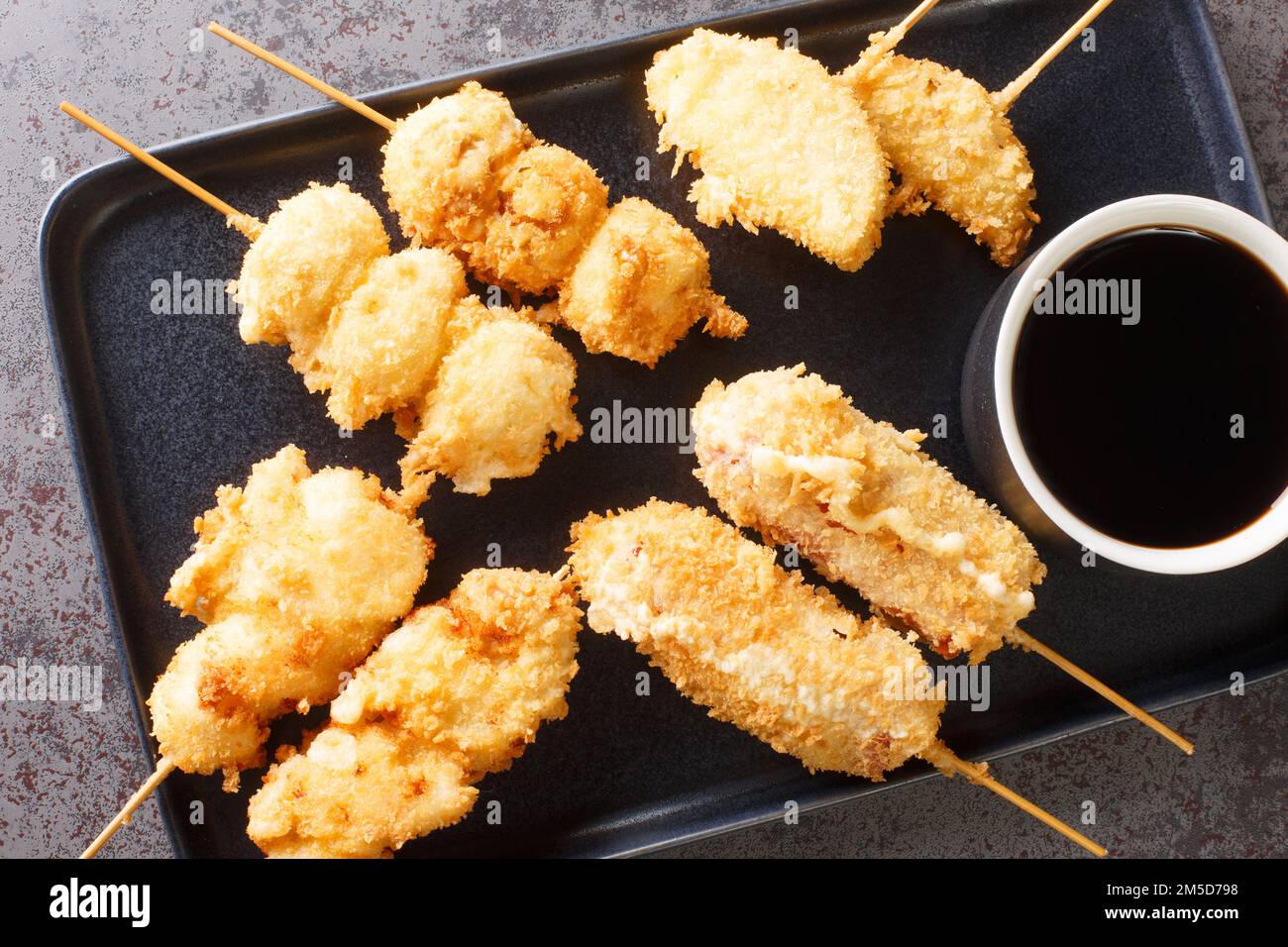 Japanese Kushikatsu Deep-fried vegetables, eggs and meat on skewer ...