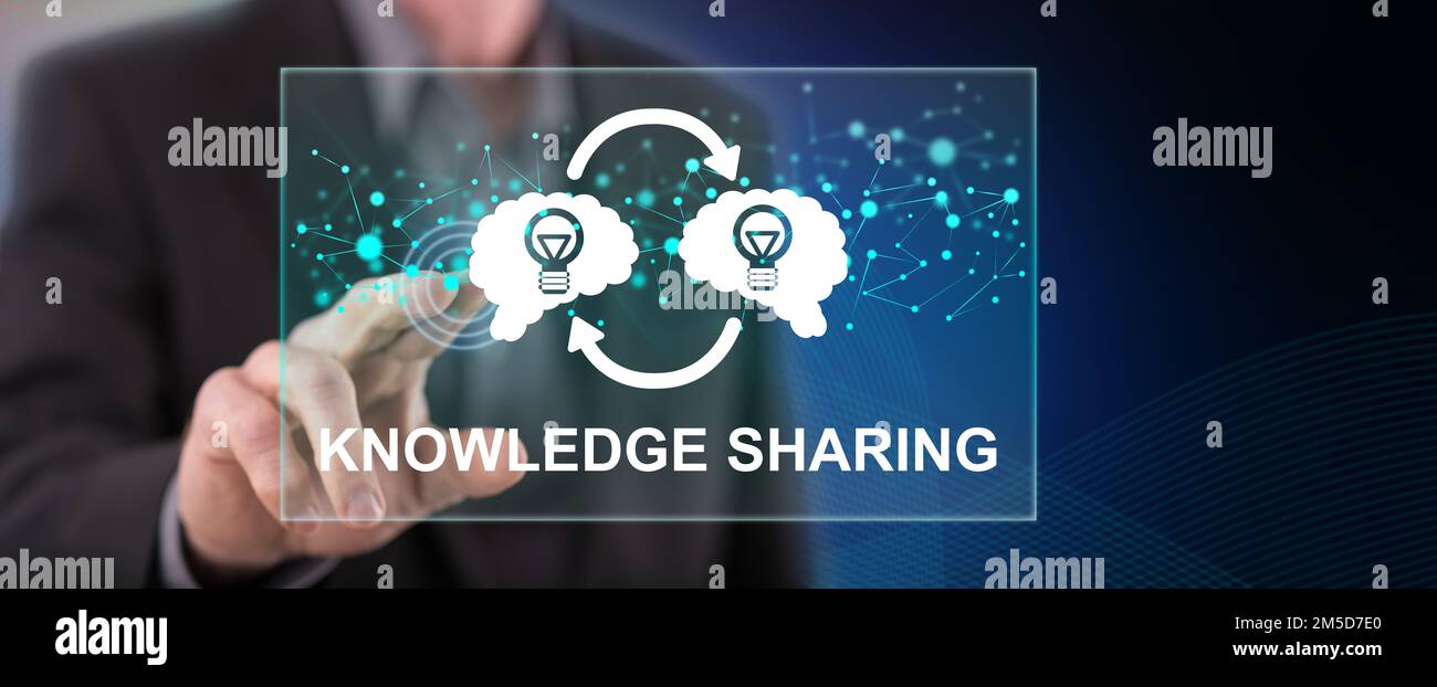 Man touching a knowledge sharing concept on a touch screen with his ...