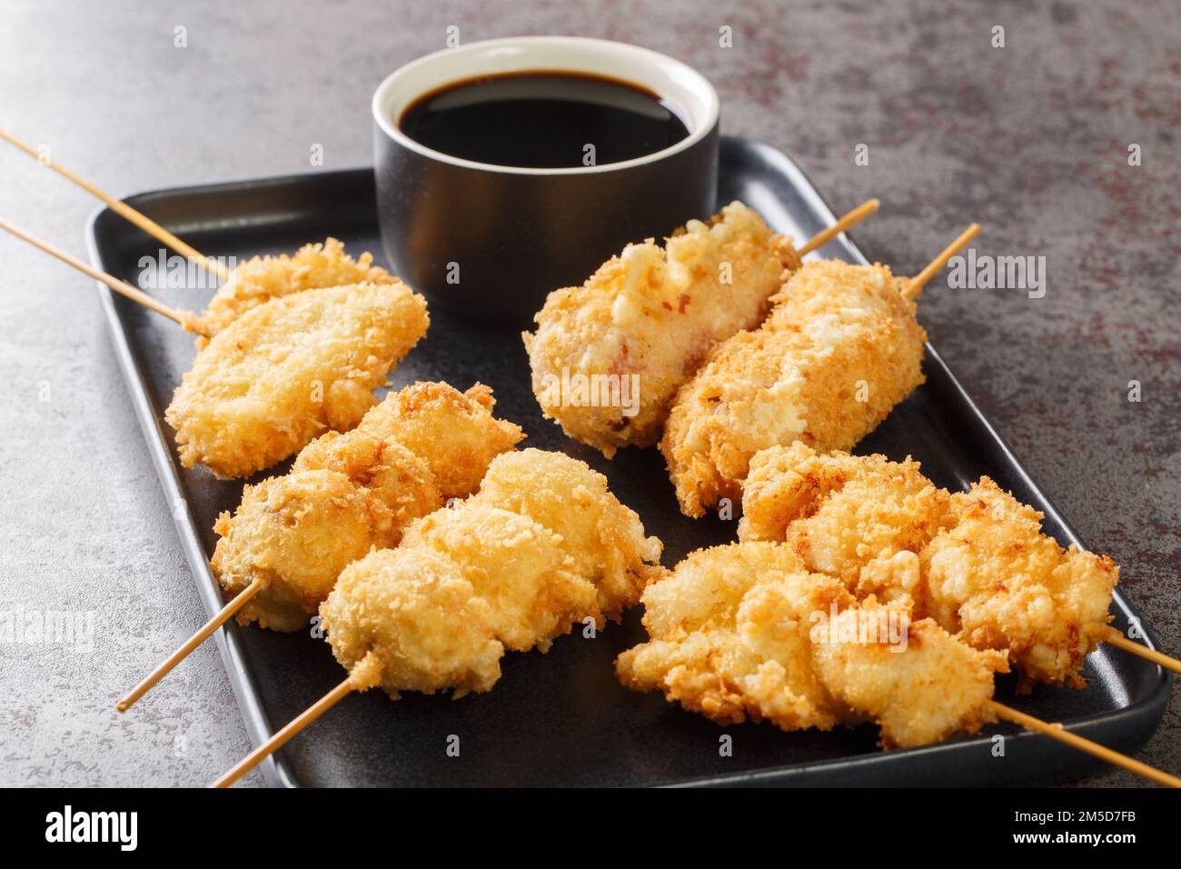 Japanese Kushikatsu Deep-fried vegetables, eggs and meat on skewer ...