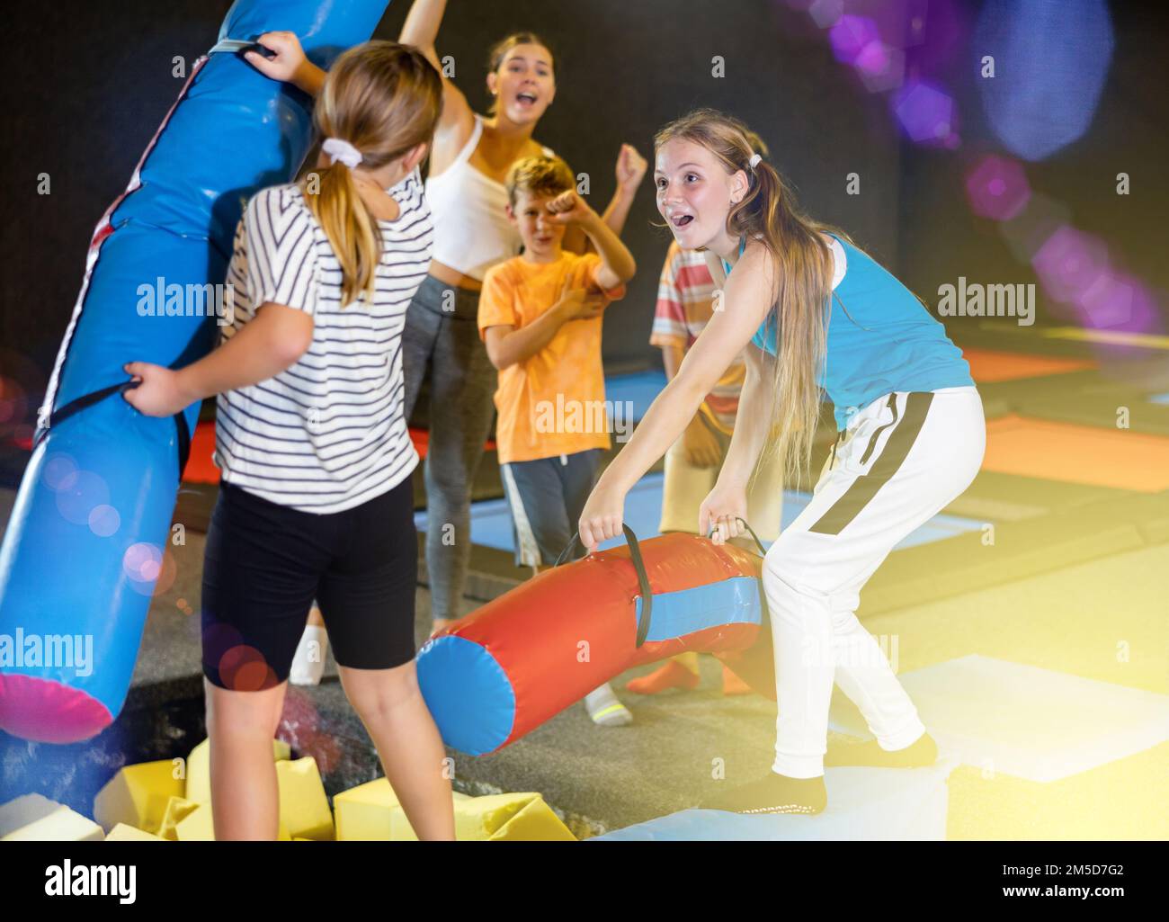 Active excited child school girls having fun and fighting with ...
