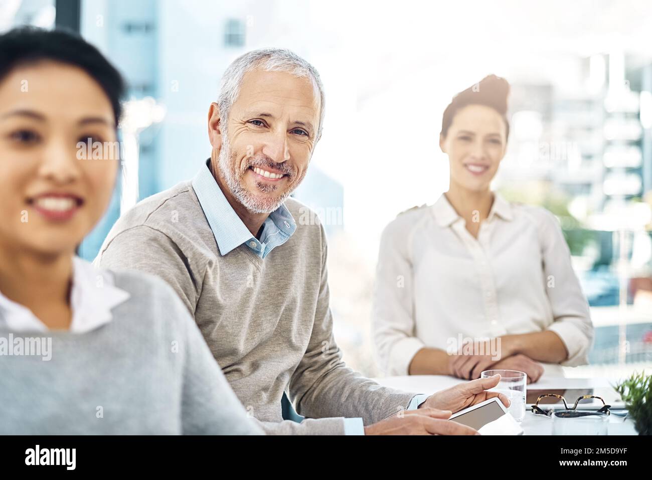 Diversity is one of out teams strengths. Portrait of a group of smiling ...