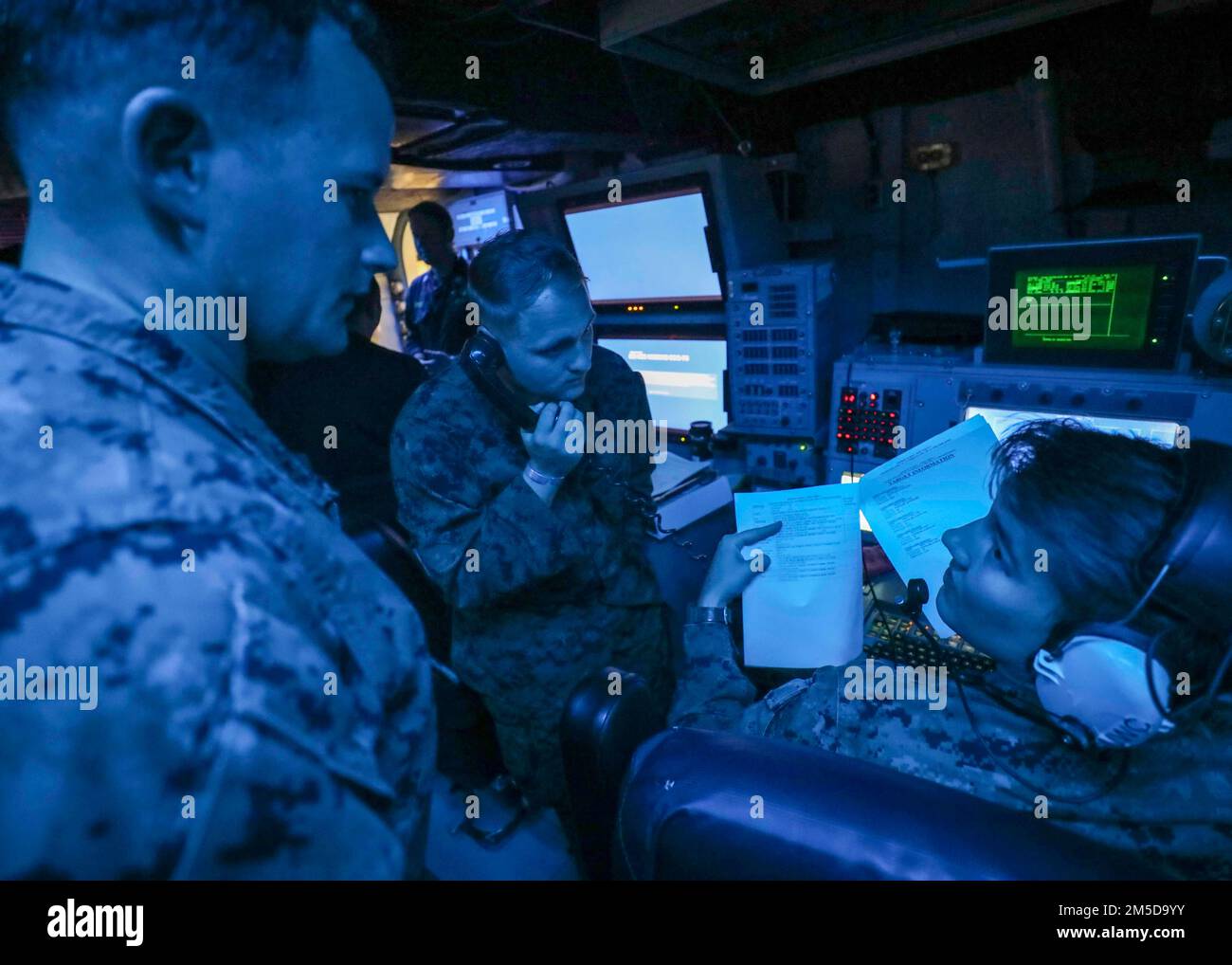 PHILIPPINE SEA (March 3, 2022) Marines discuss communications during an ...