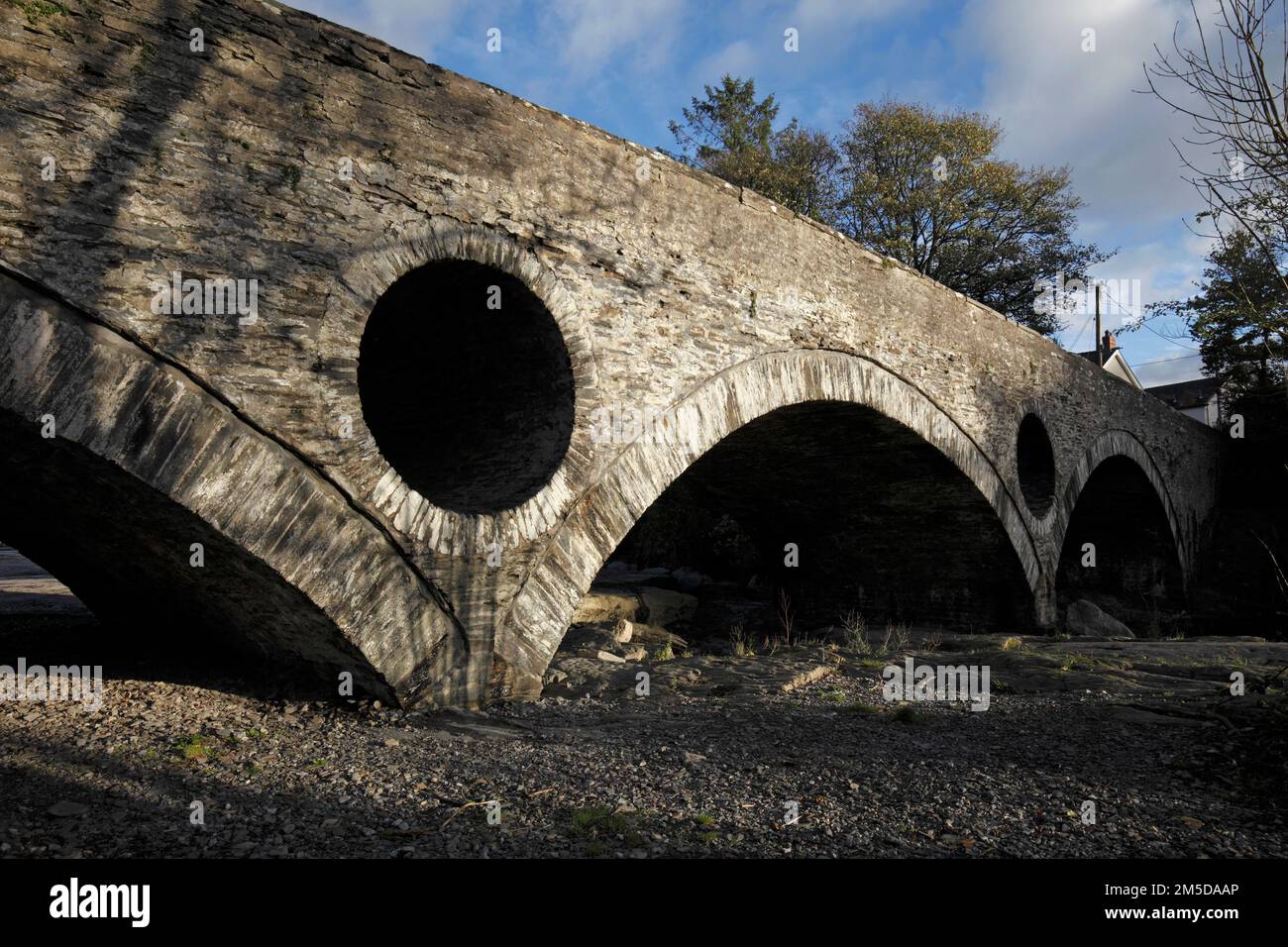 Cenarth stone bridge over the river Teifi. Just below the cascade of ...