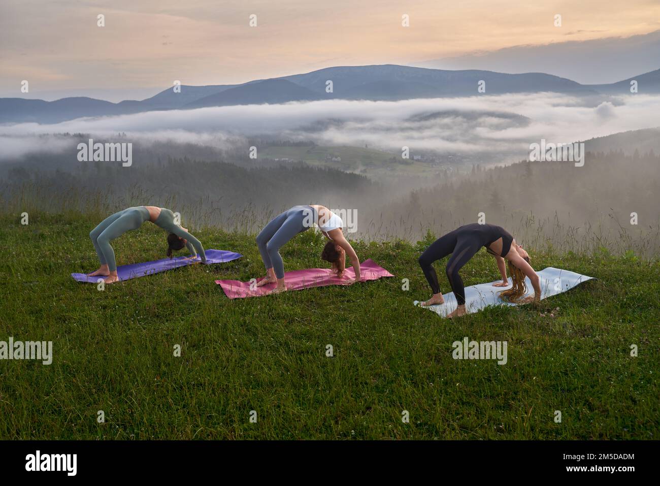 Group three people doing meditation hi-res stock photography and images ...