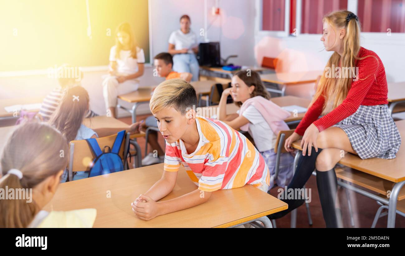 Kids resting in classroom during recess Stock Photo - Alamy