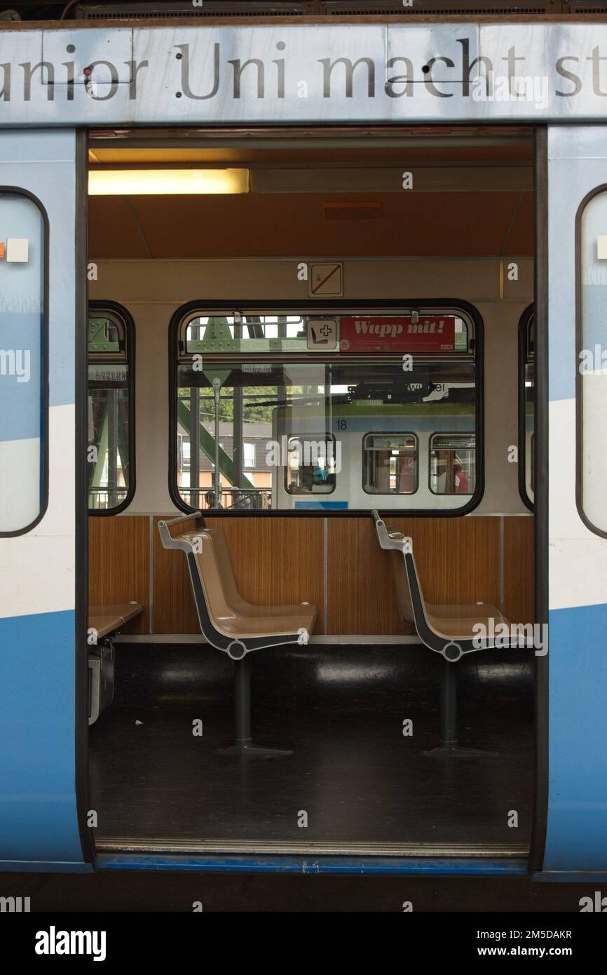 A vertical of the seats inside of the Wuppertal monorail captured ...