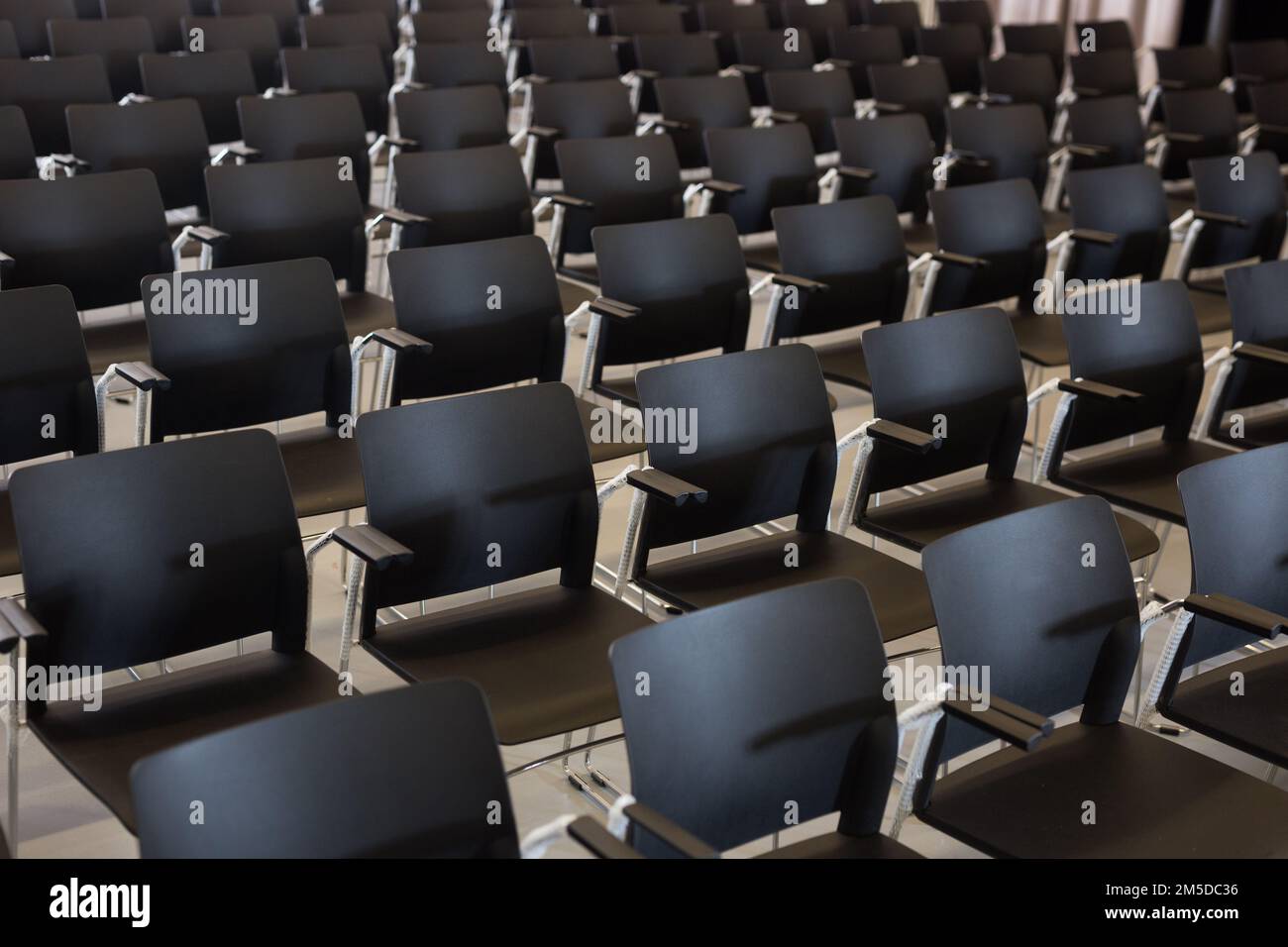 Plastic chairs in conference room Stock Photo - Alamy