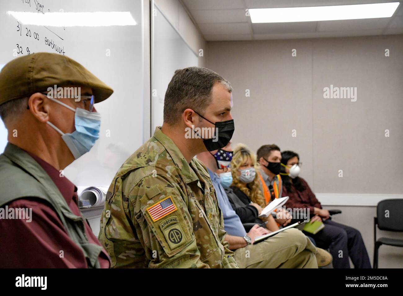 Employees and service members with the U.S. Army Corps of Engineers ...