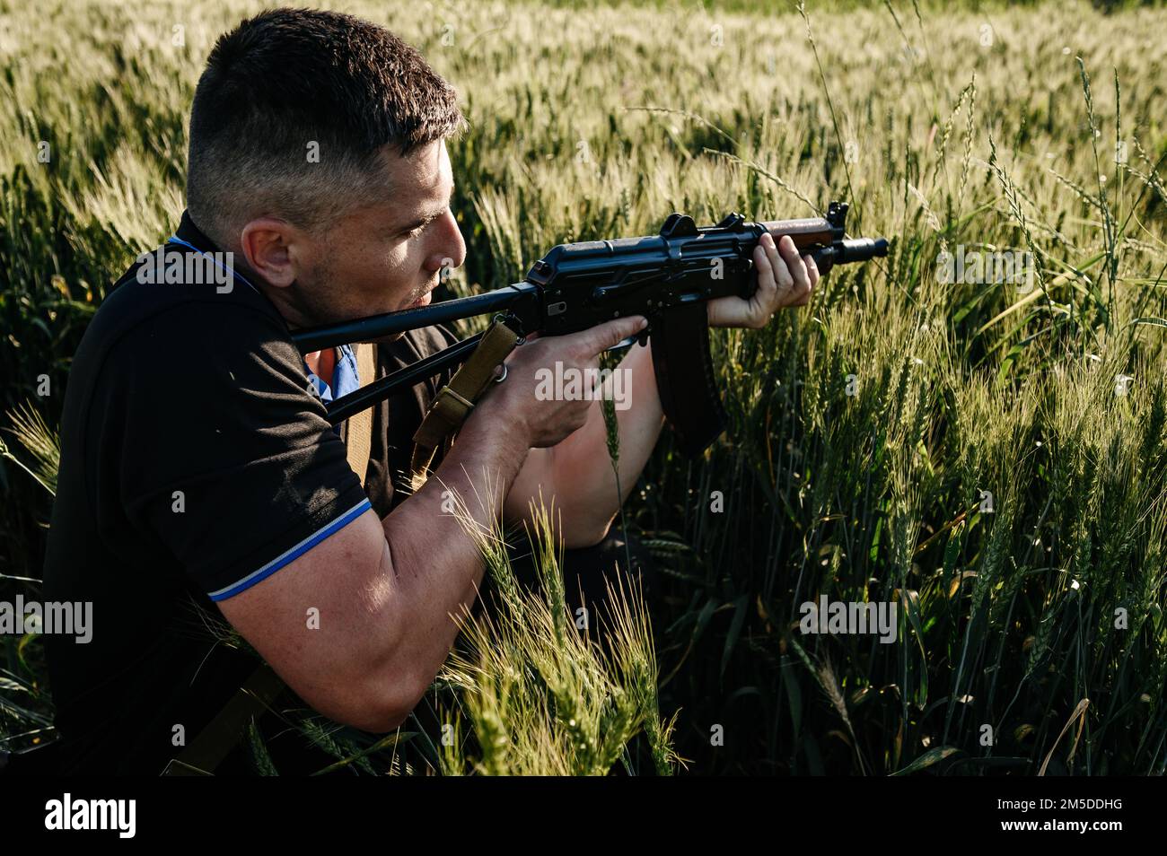 The man in the field with a machine gun, Ukrainian men are preparing ...