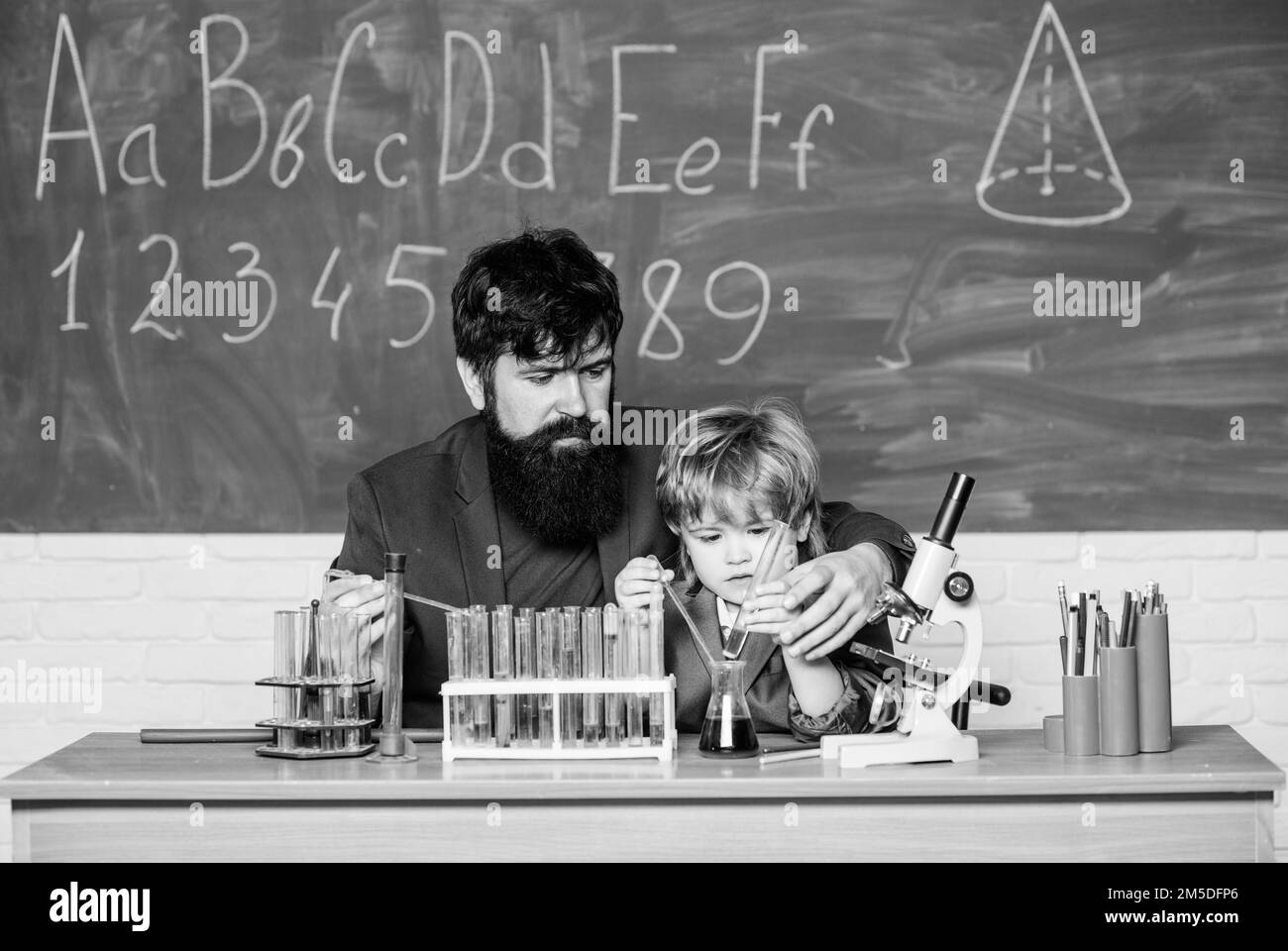 Back to school. Scientist research and experiments father and son at ...
