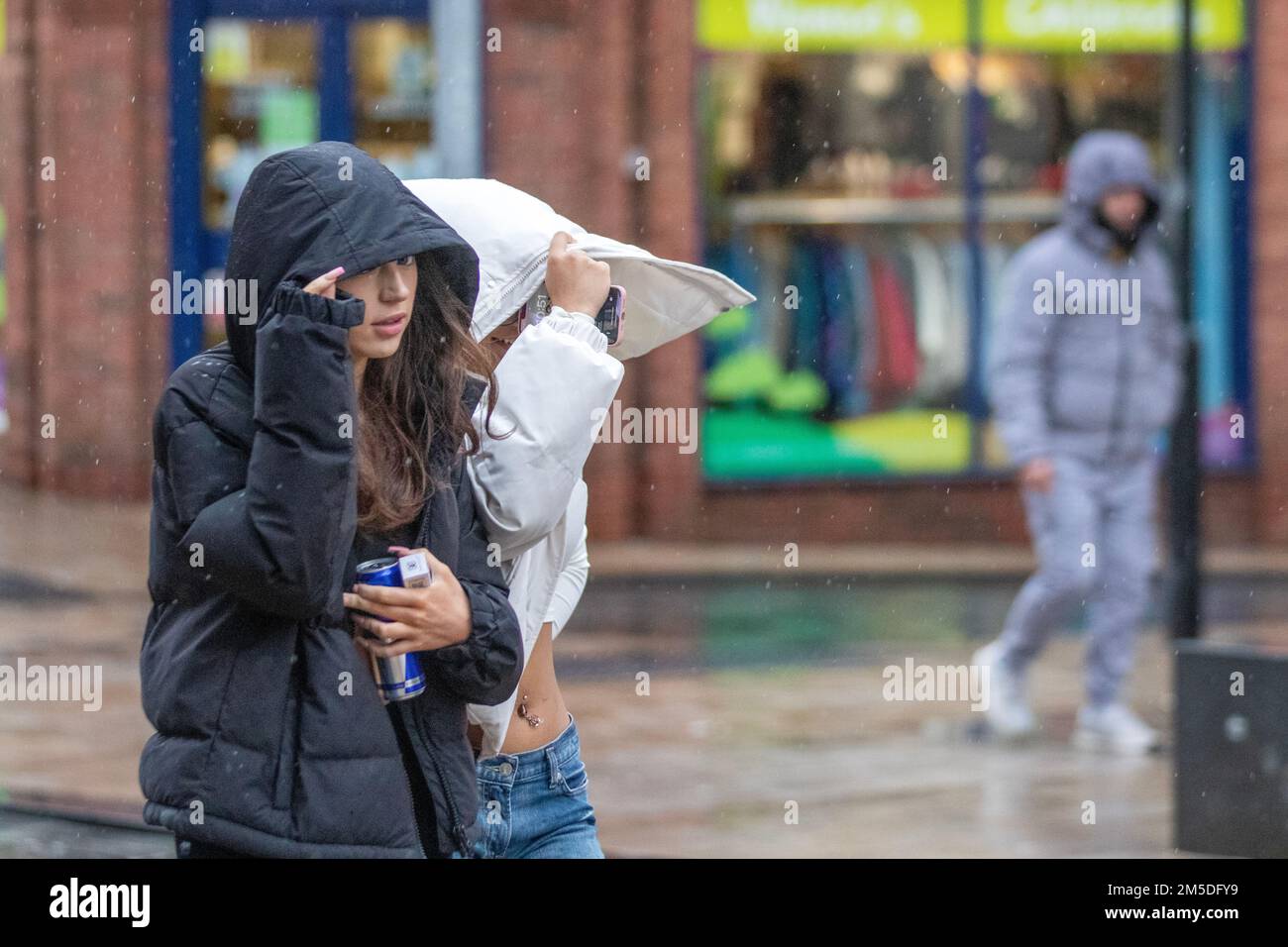 Two girls holding hoods hi-res stock photography and images - Alamy