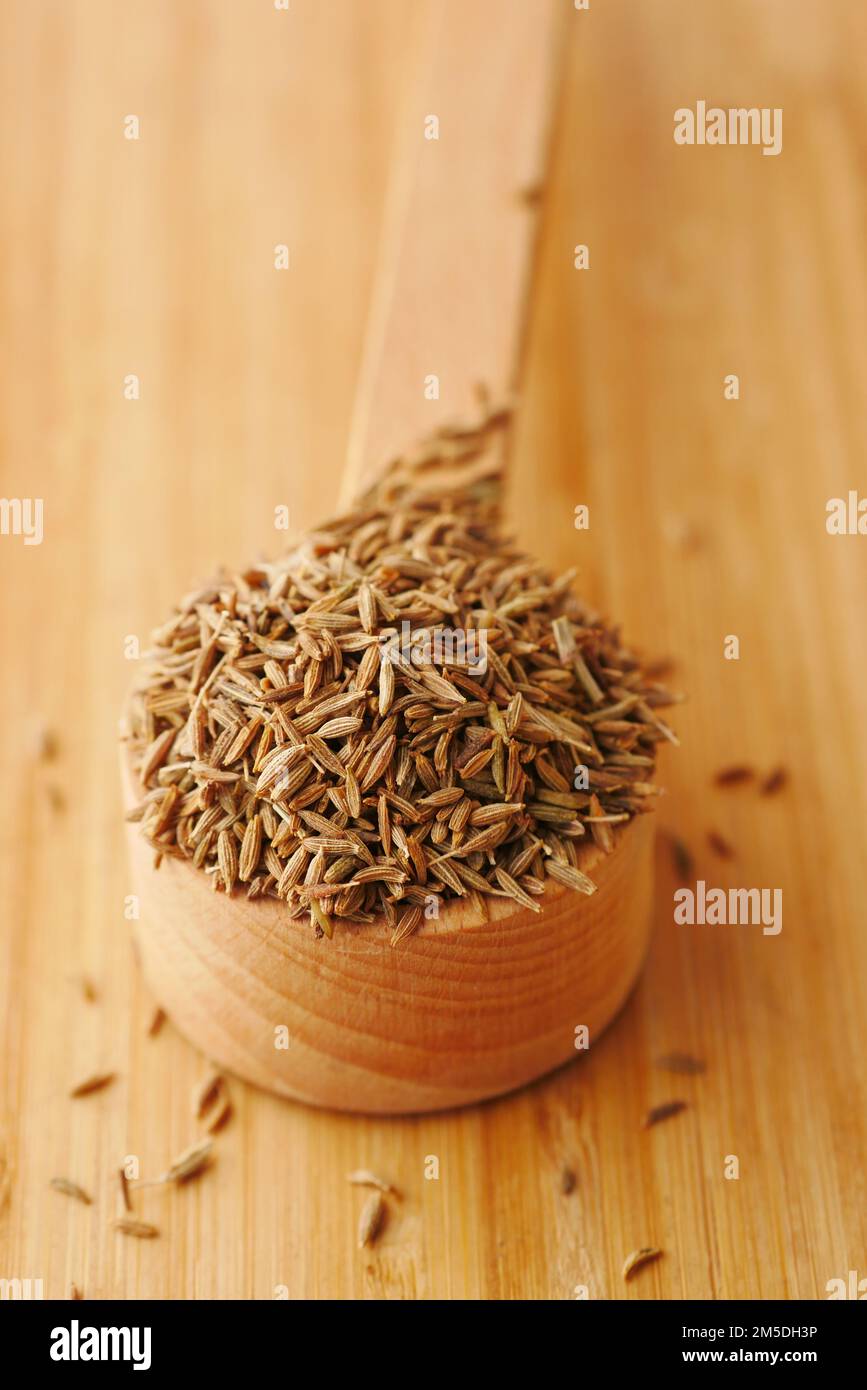 cumin seeds on spoon on table , close up Stock Photo - Alamy