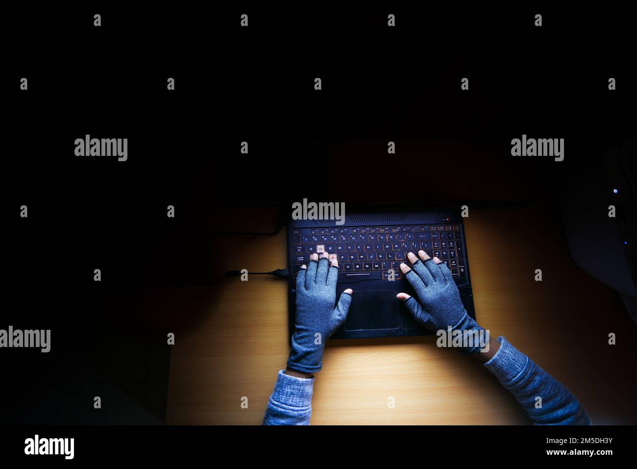 hacker hand stealing data from laptop top down Stock Photo - Alamy