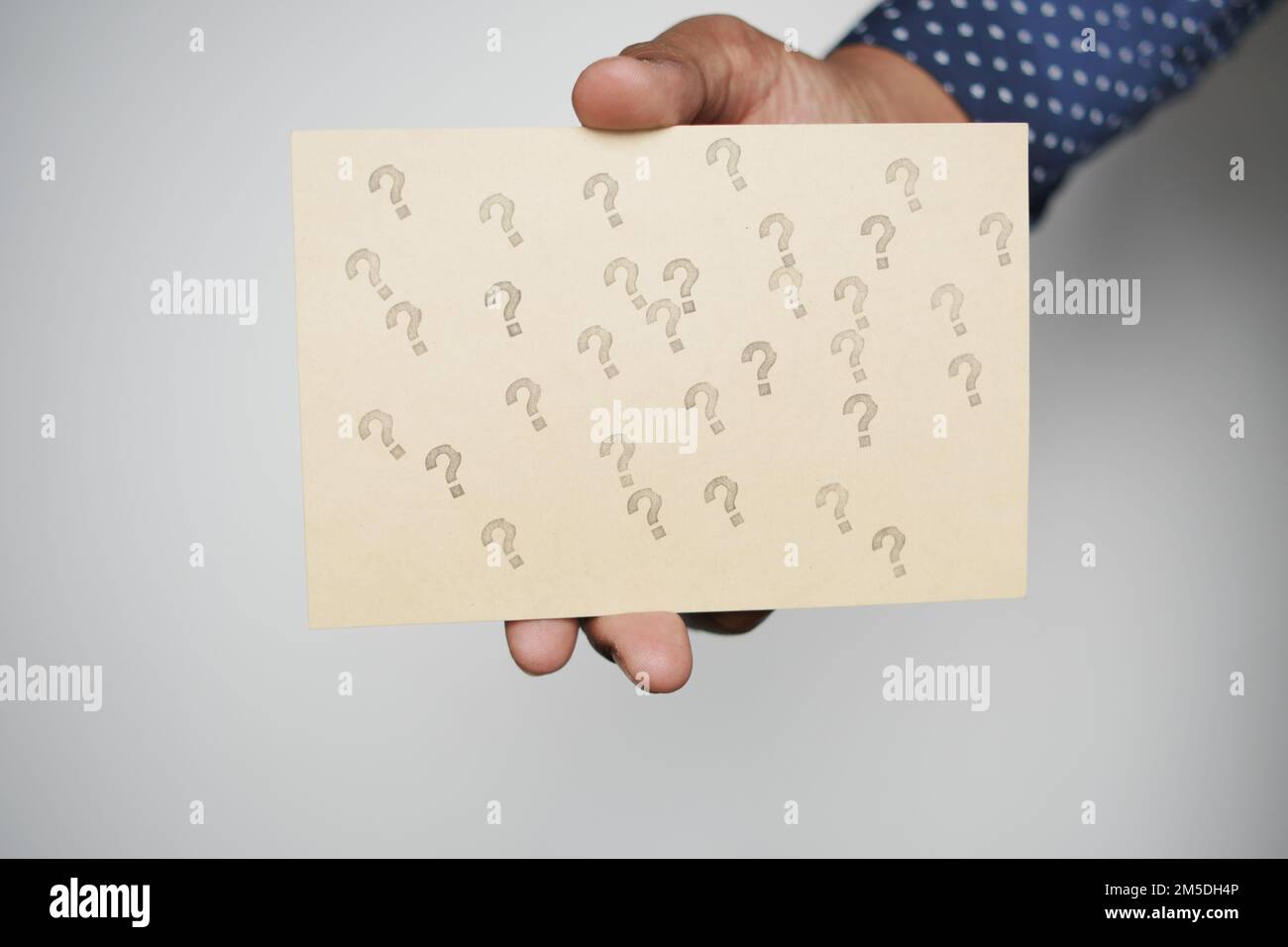 men holding a question mark on paper Stock Photo - Alamy