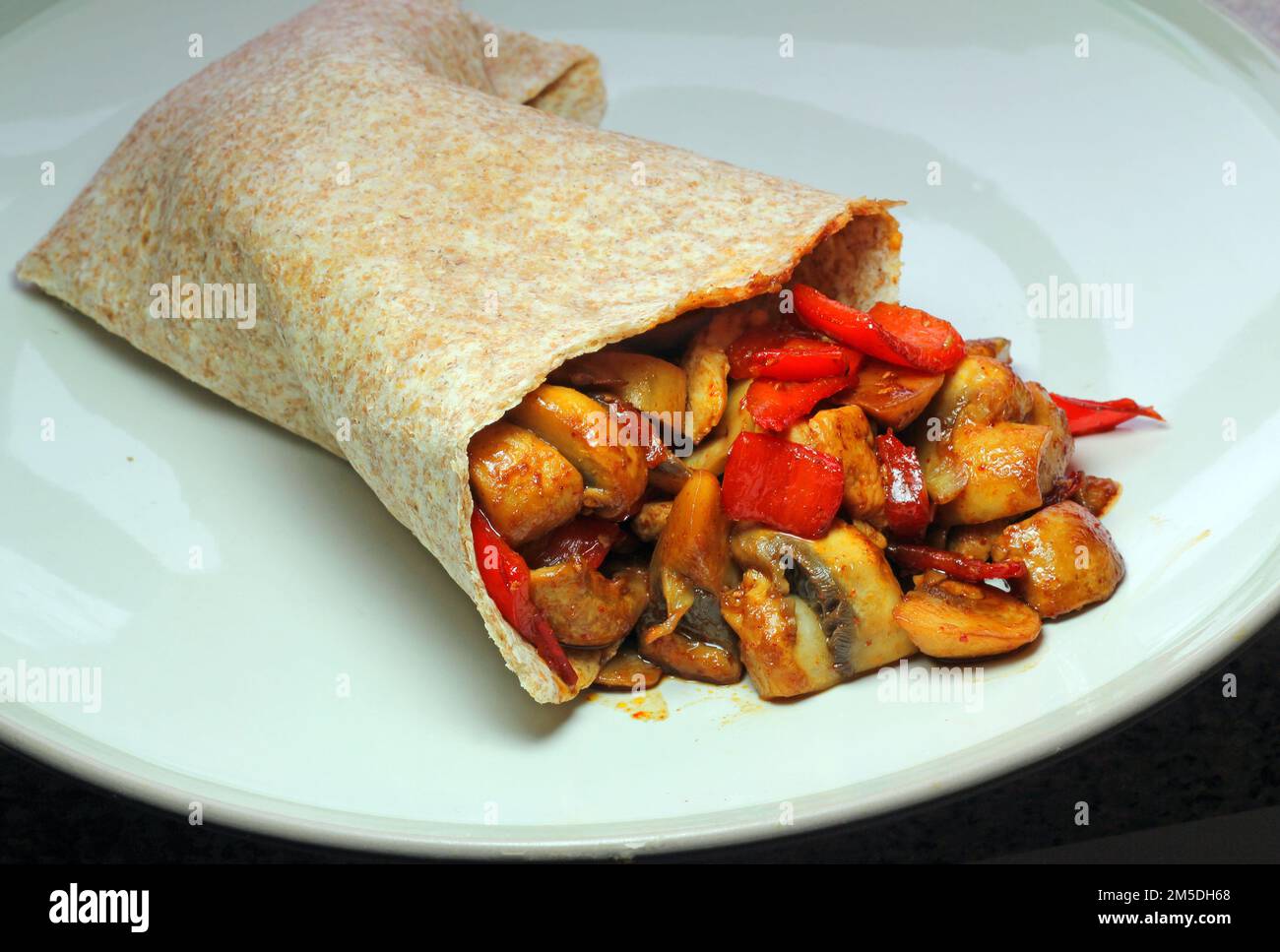 Cooked stir fried vegetables together in a pitta bread Stock Photo - Alamy