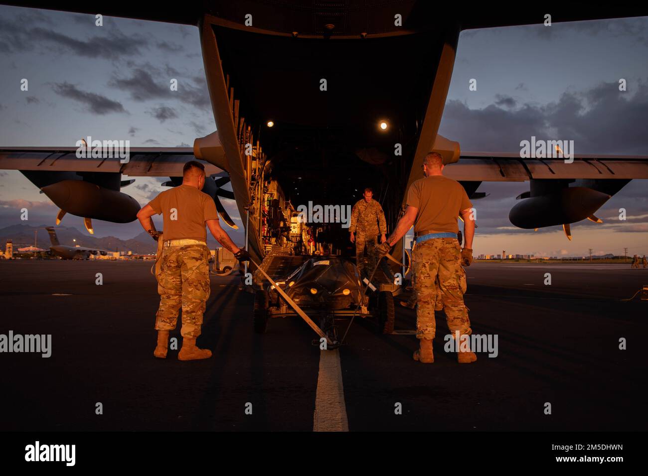 Airmen from the Nevada Air National Guard load cargo onto a C-130 ...