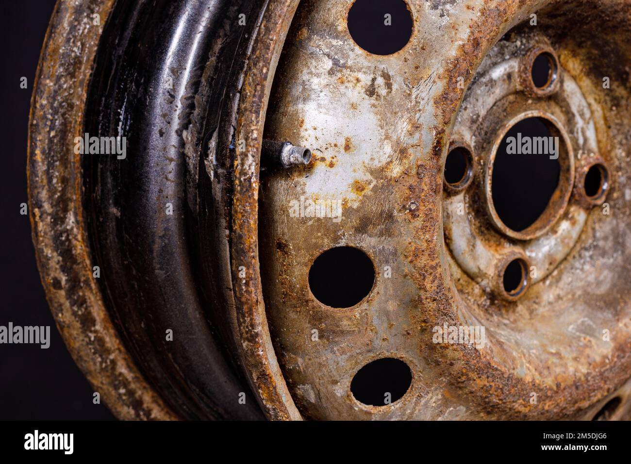 old metal car rim with rust close-up on a black background Stock Photo ...