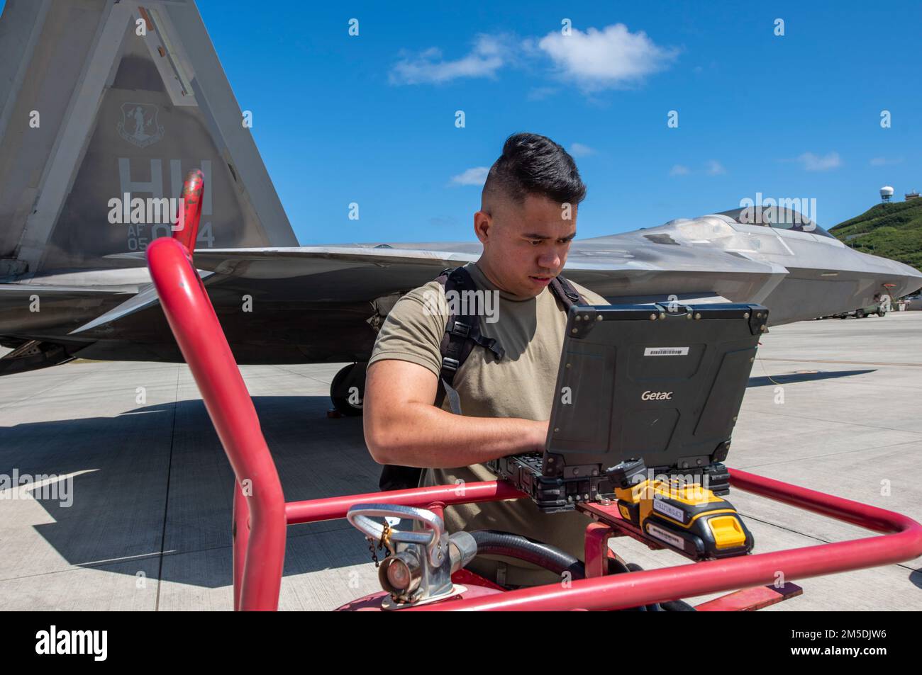 An F-22 Raptor crew chief assigned to the 154th Aircraft Maintenance ...