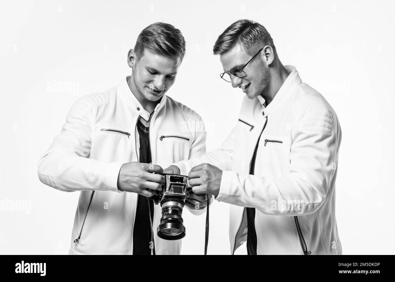 young twin brothers photographer with similar appearance make photo ...
