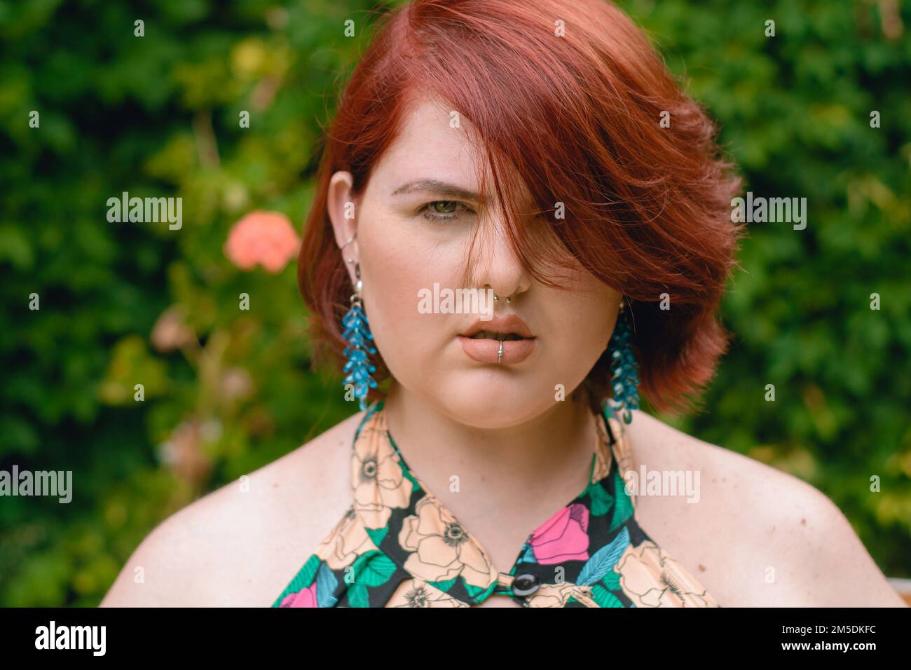 portrait of young latina caucasian argentinian woman with short red ...