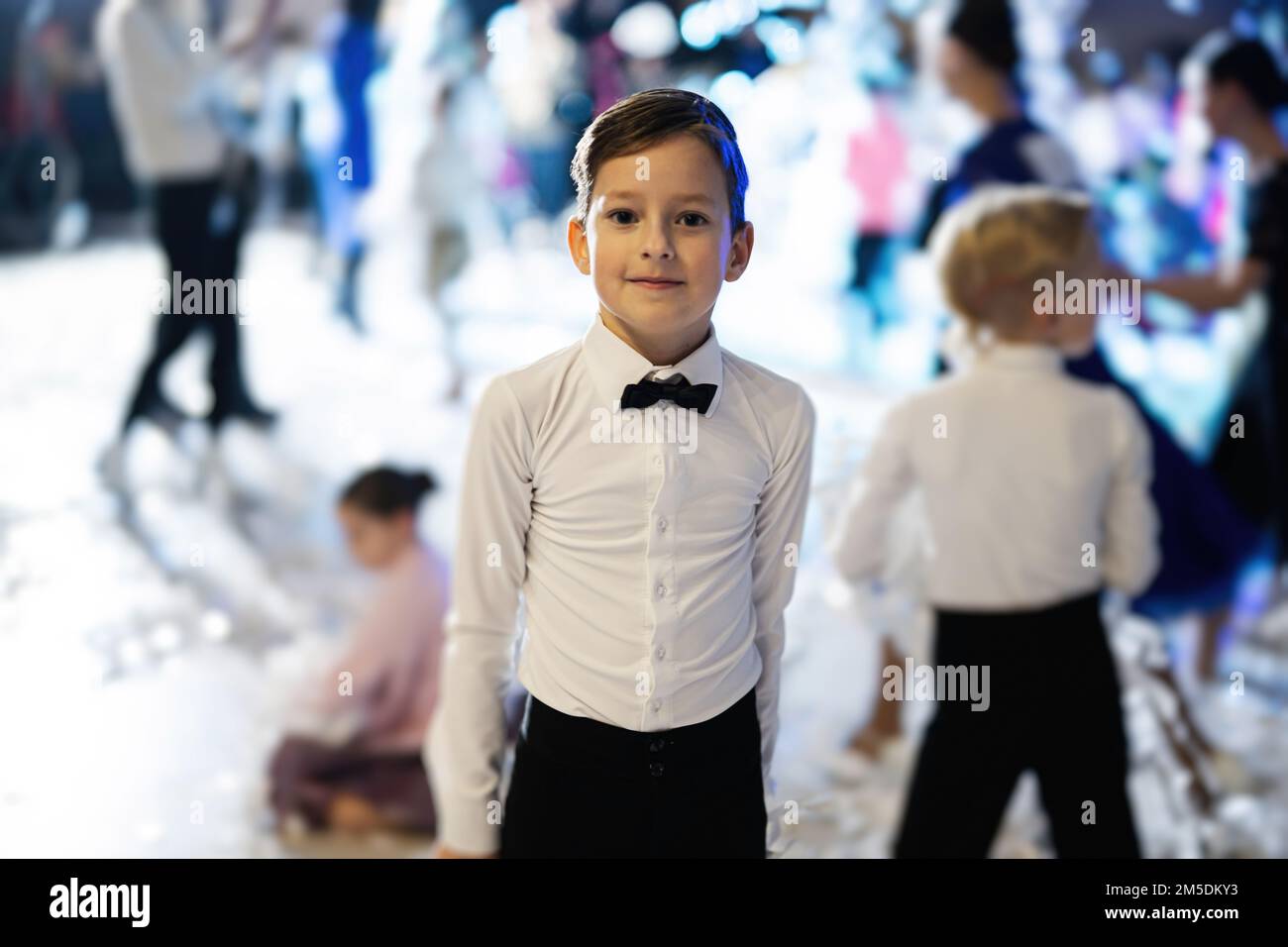 Boy in white shirt and bow tie, dance costume at children party Stock Photo - Alamy