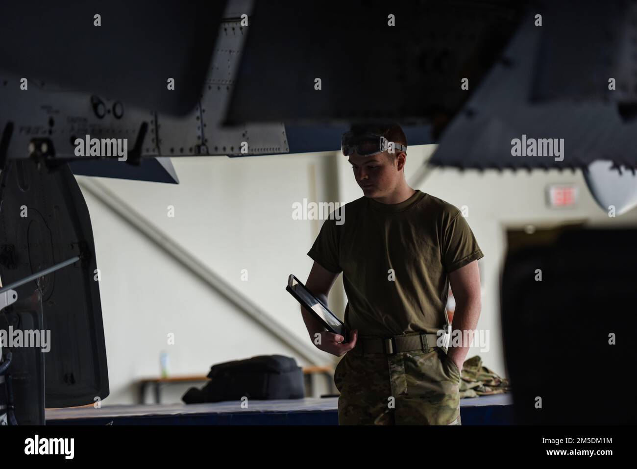 Airman Nicholas Blaylock from Alabama looks over a digital technical ...