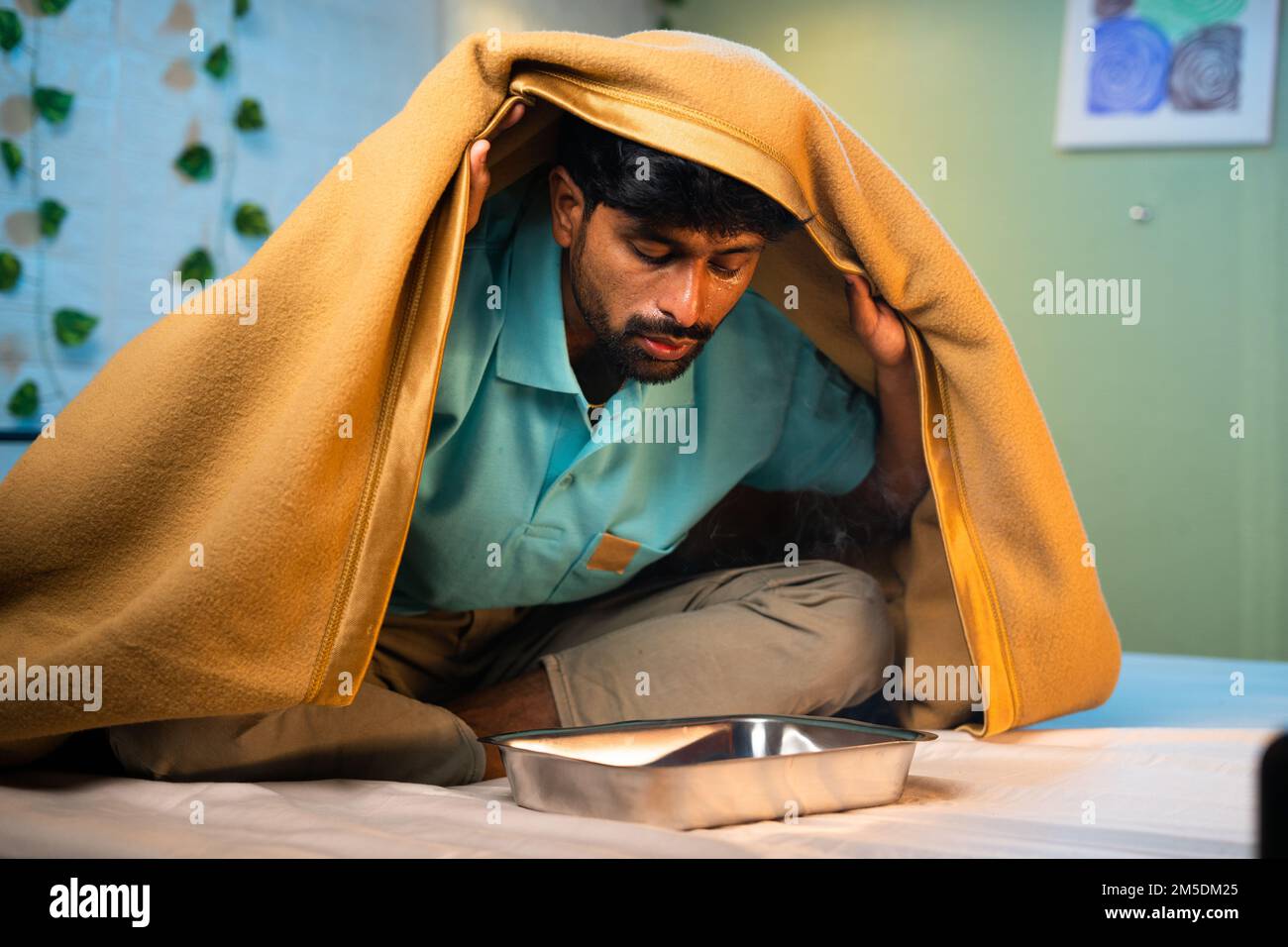 sick man taking inhaling menthol steam vapour to get relief from cough ...